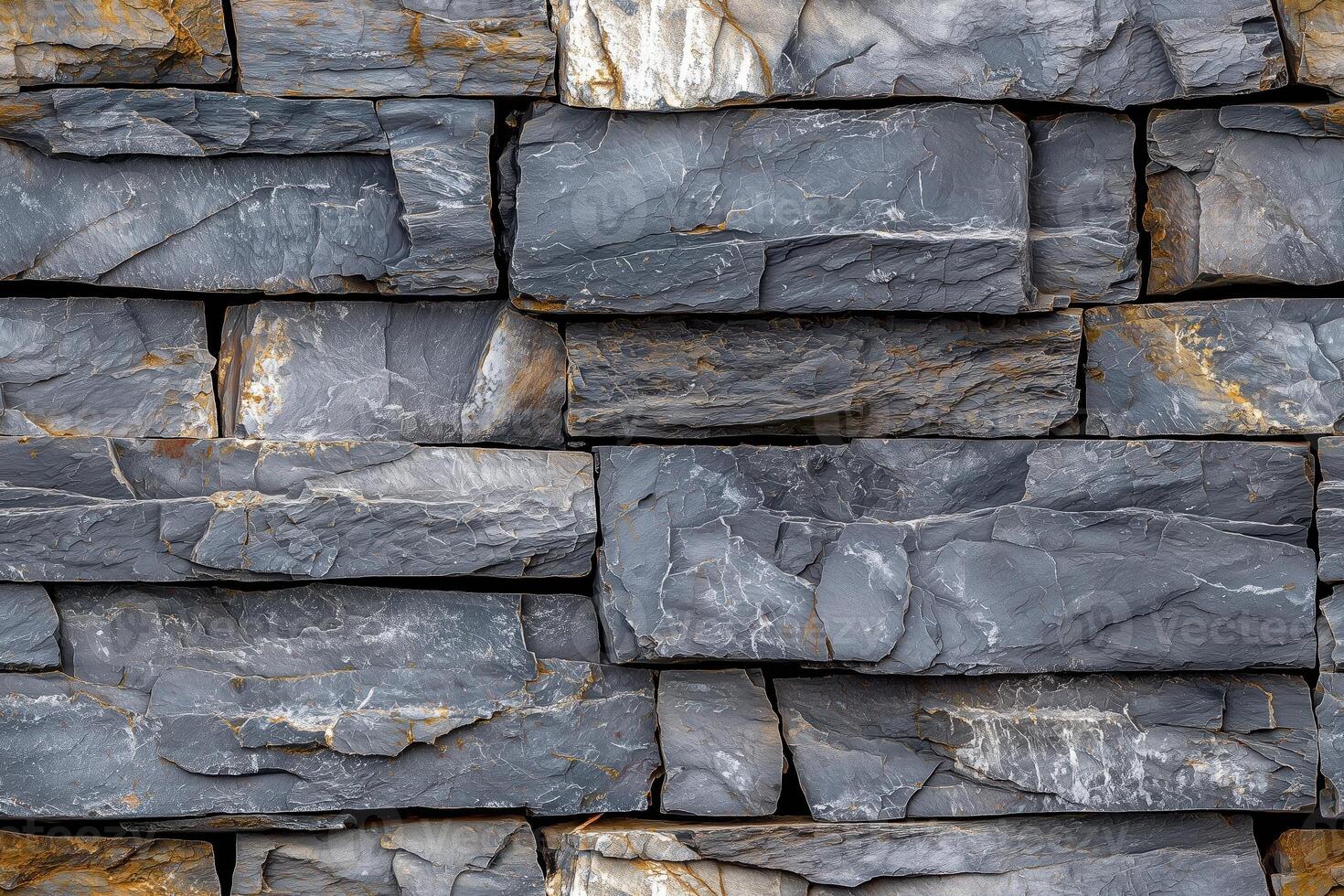 Textured artesia stone cladding wall made of gray slate tiles ...