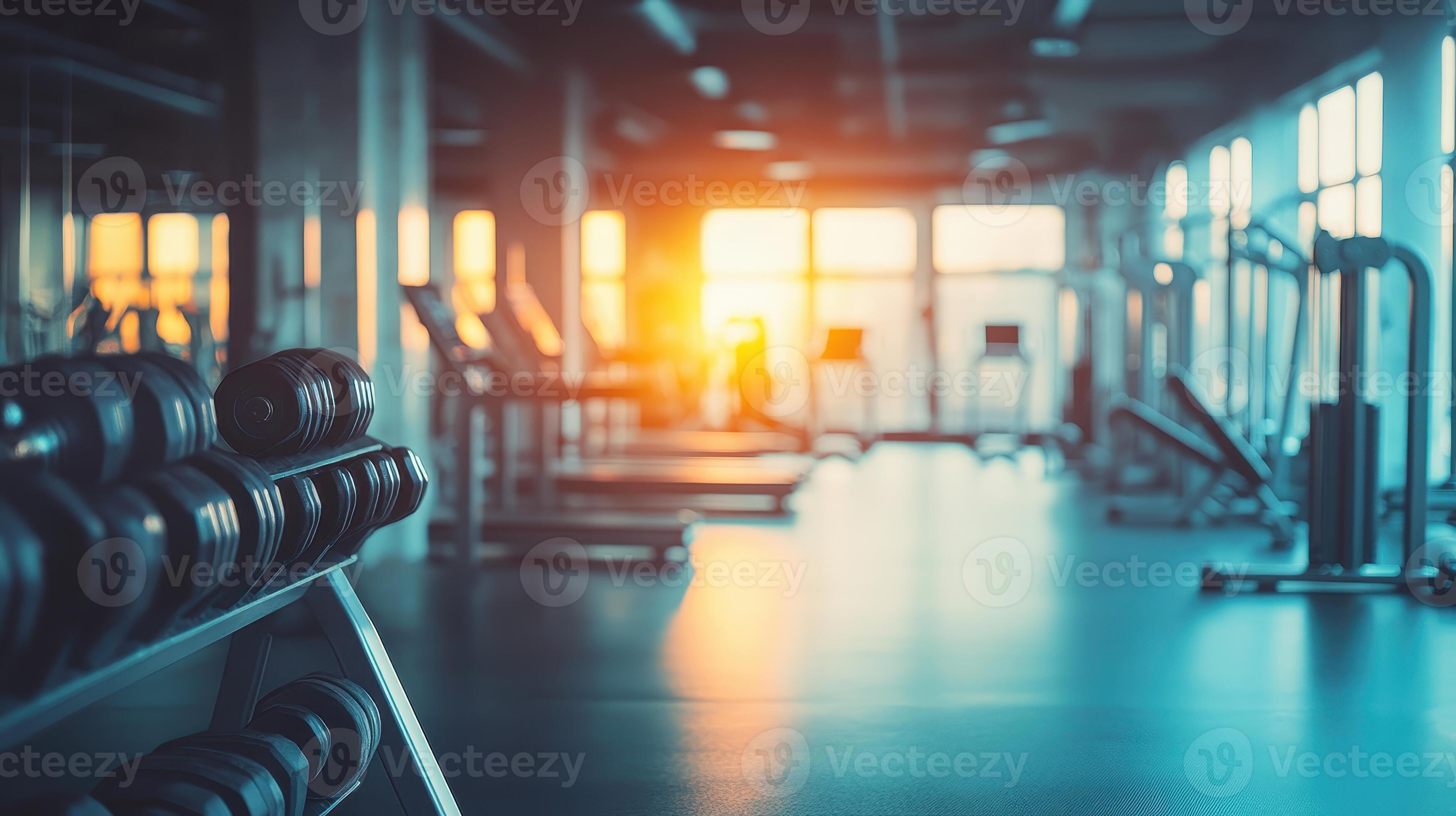 A modern gym interior at sunset, featuring dumbbells and fitness ...