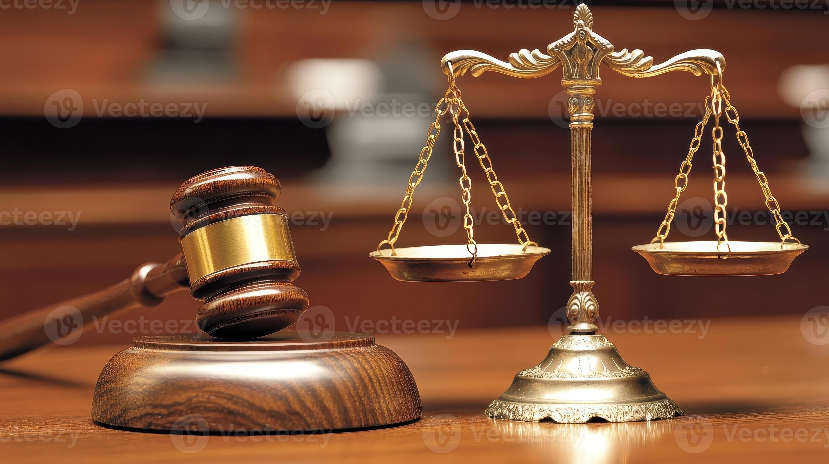A gavel and scales of justice symbolizing law and fairness in a courtroom setting. 59164471 ...