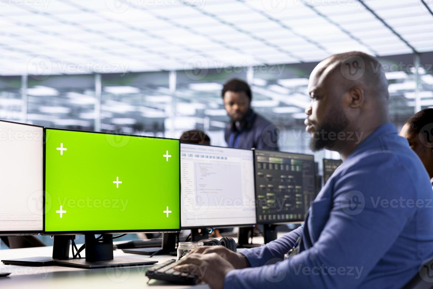 Server room facility admin ensuring data remains shielded from potential threats using mockup PC ...