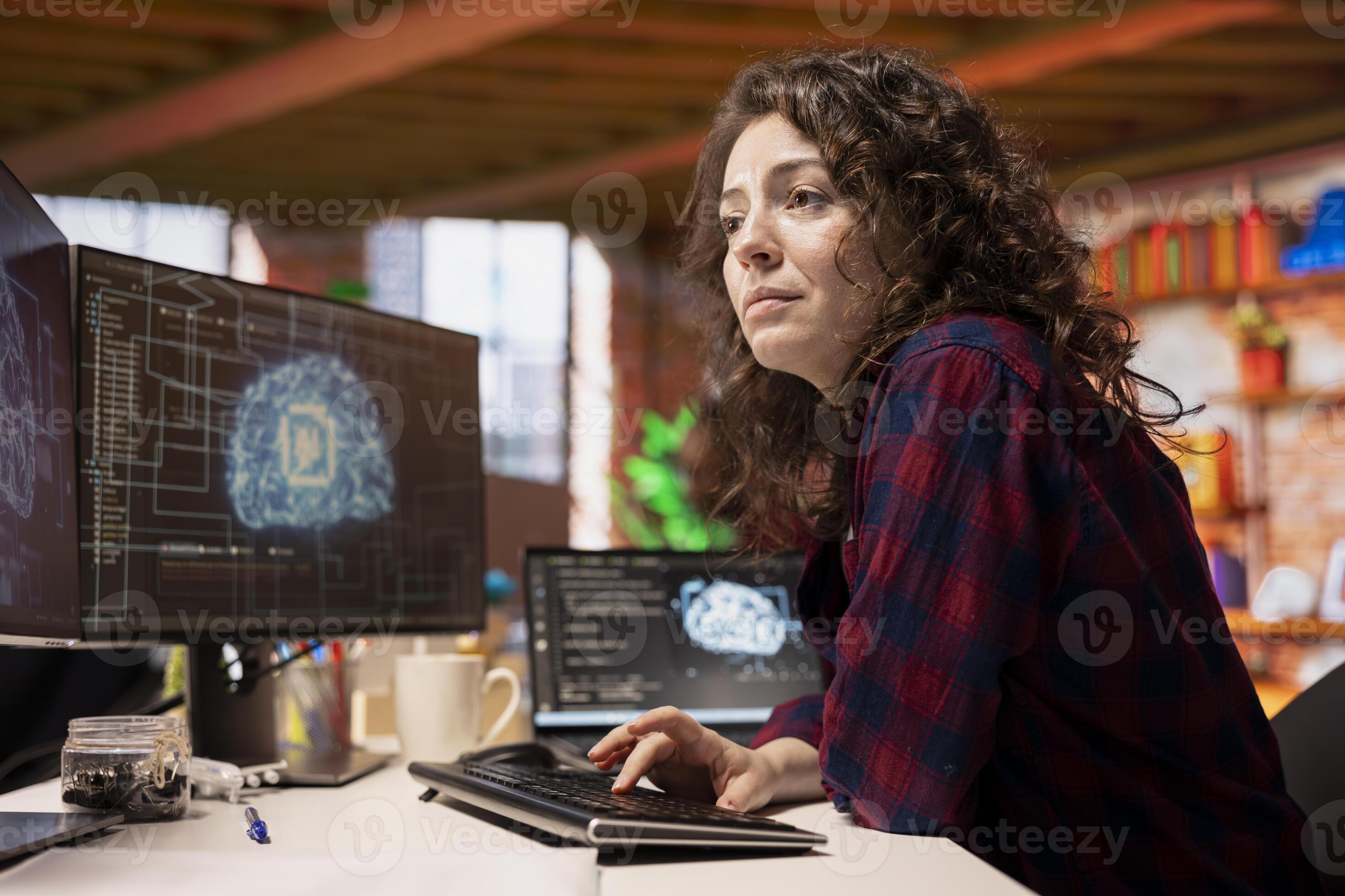 System administrator in startup office coding advanced AI algorithm and machine learning models ...