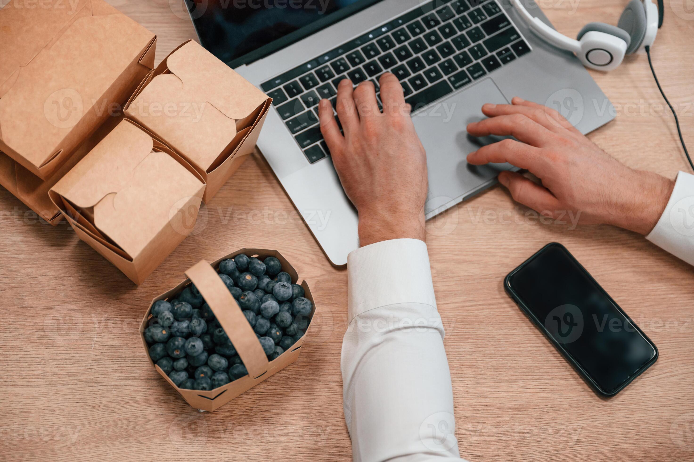 Typing On Keybord Top View Of Hands Of The Man That Is Working By Using Laptop Eco Boxes With