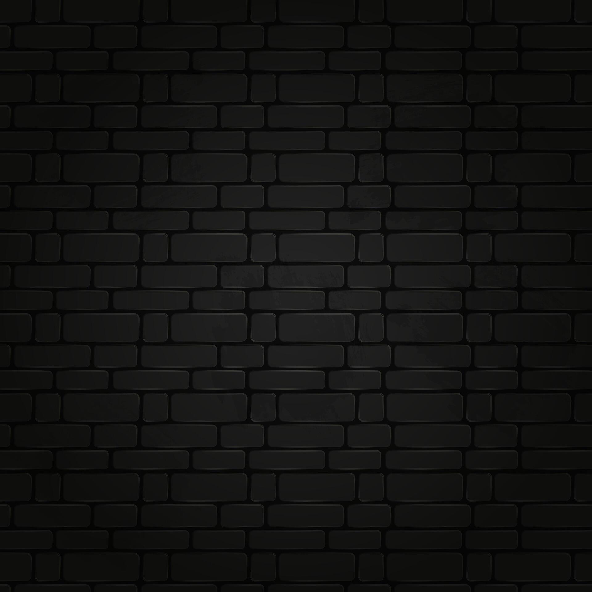 Dark brick wall pattern featuring uniform, aligned rectangular bricks ...