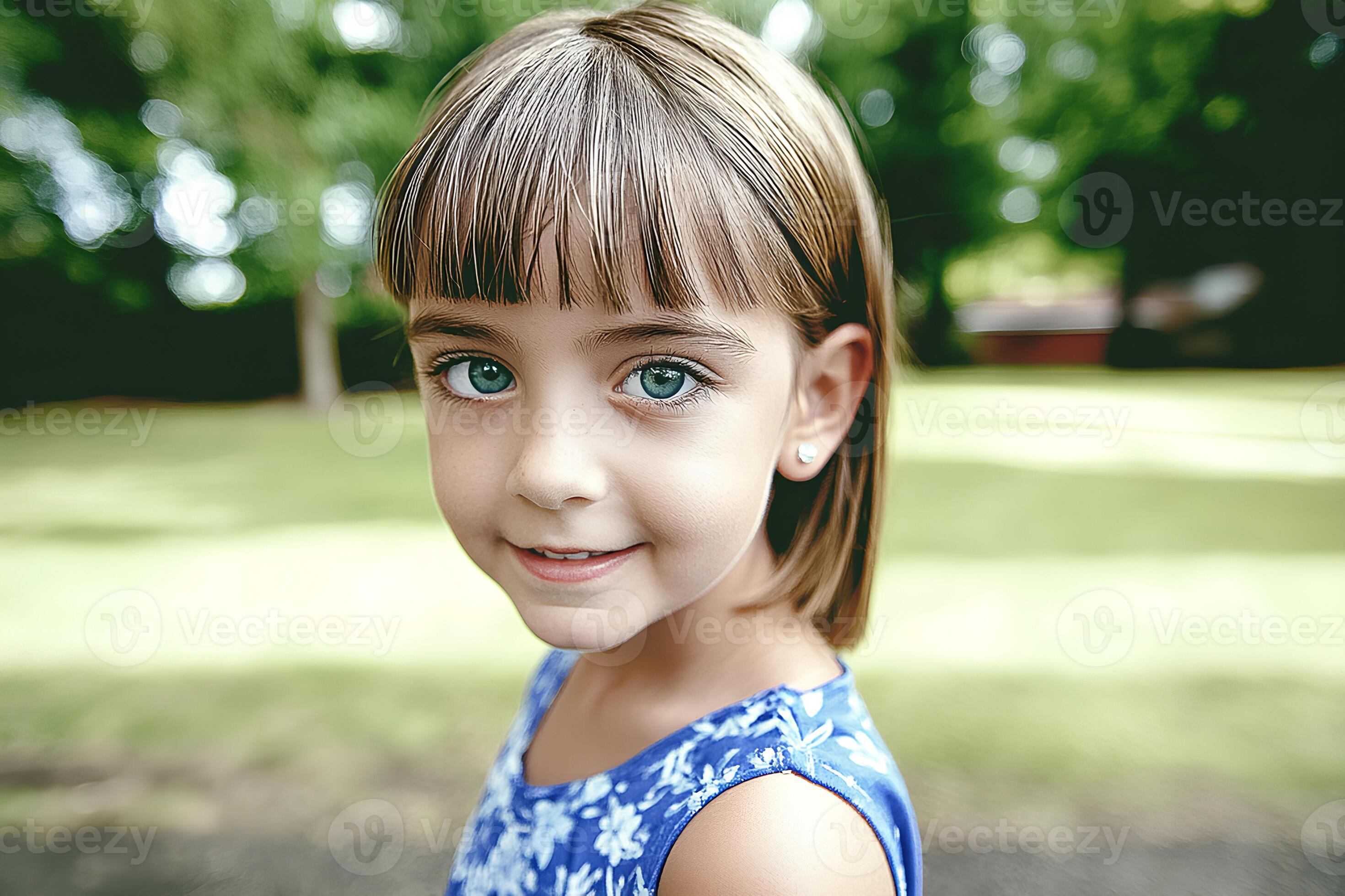 A heartwarming portrait of a young girl in a blue dress, smiling in a lush park, capturing the ...