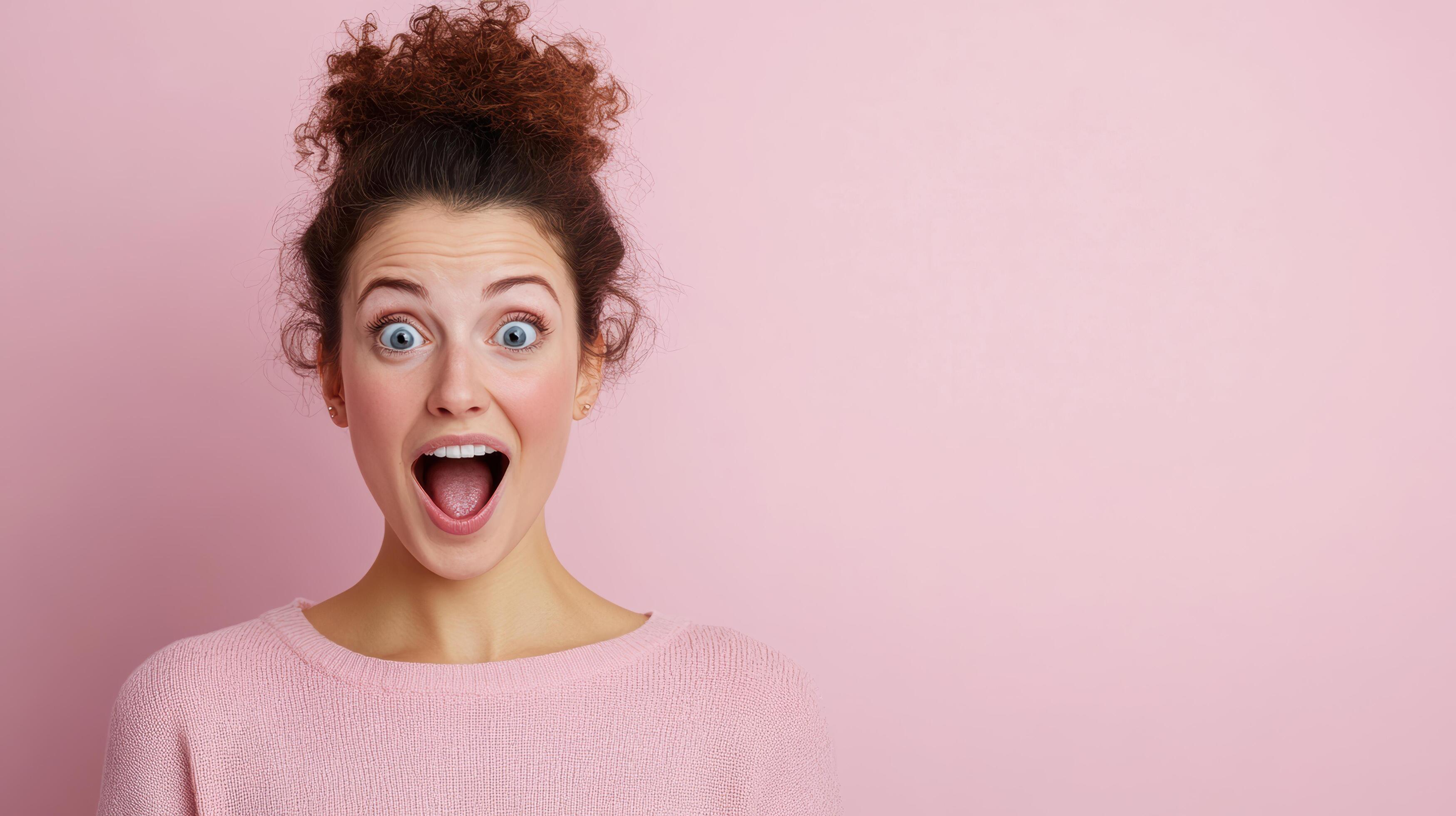 woman expressing surprise with wide eyes and open mouth against pink background 60174382 Stock ...