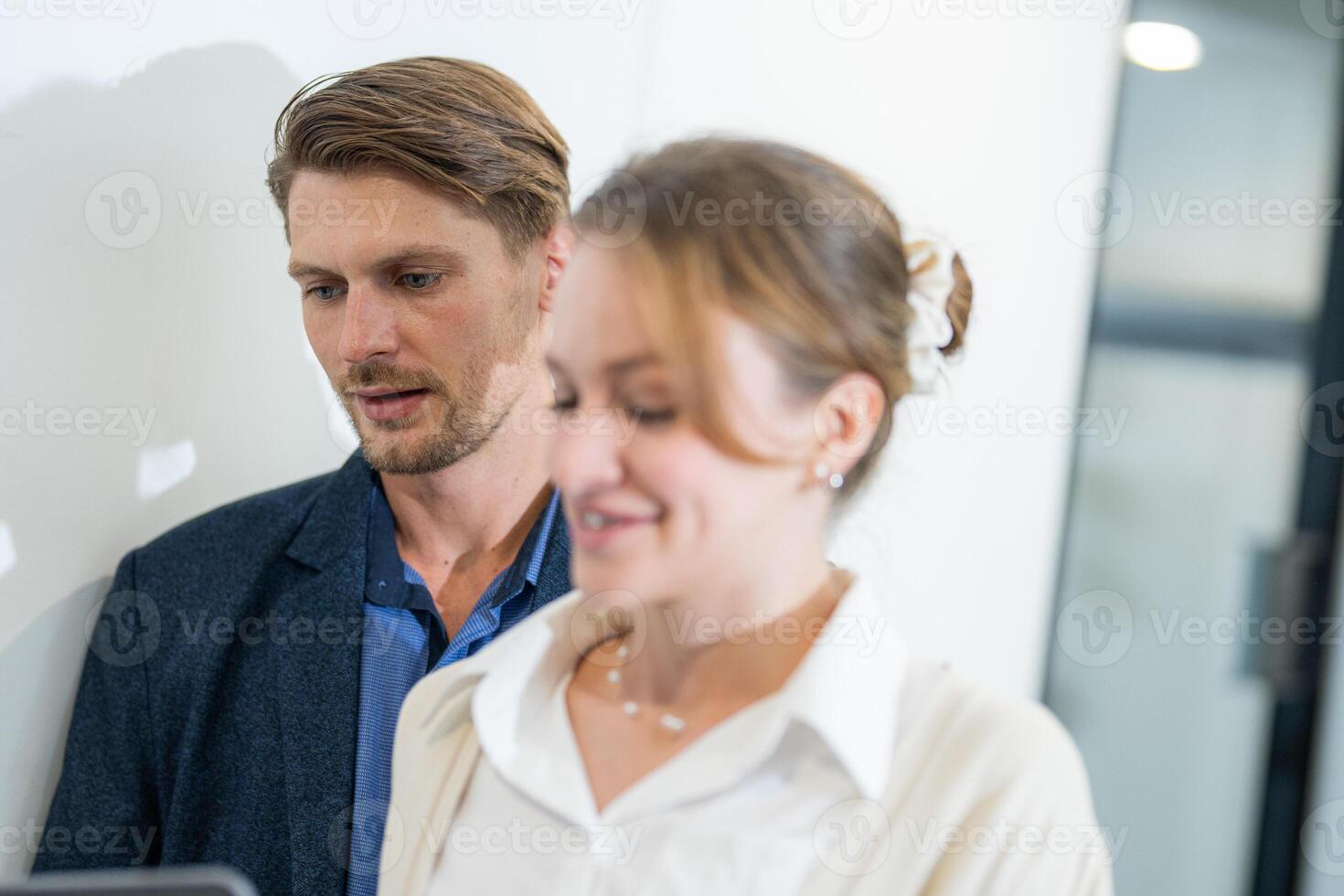 Couple discusses project details in modern office setting while taking ... Couple discusses project details in modern office setting while taking ...