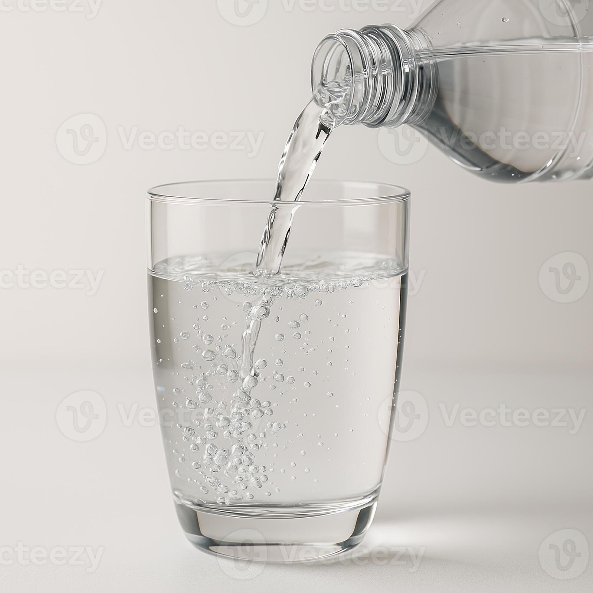 Crystal Clear Mineral Water Pouring from Bottle into Glass with Bubbles 65623600 Stock Photo at ...