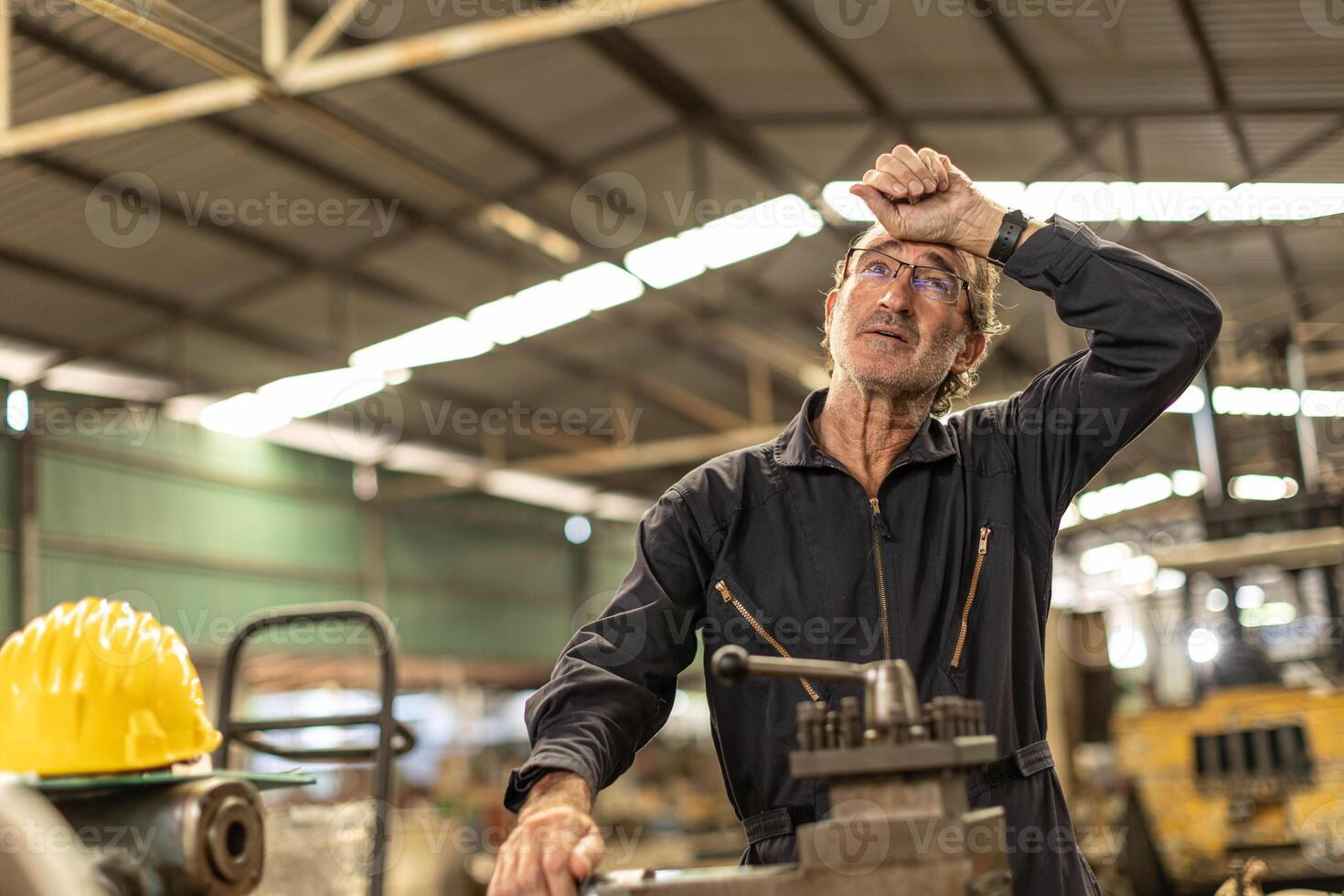 Senior worker hot tired exhausted headache pain suffer from hard work in heavy industry factory ...