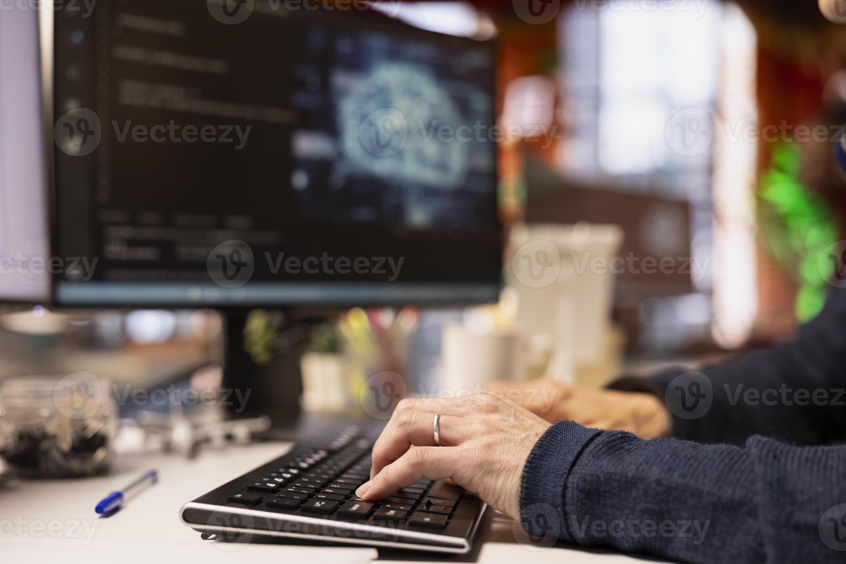 Admin typing on PC keyboard in startup office, coding advanced AI ...