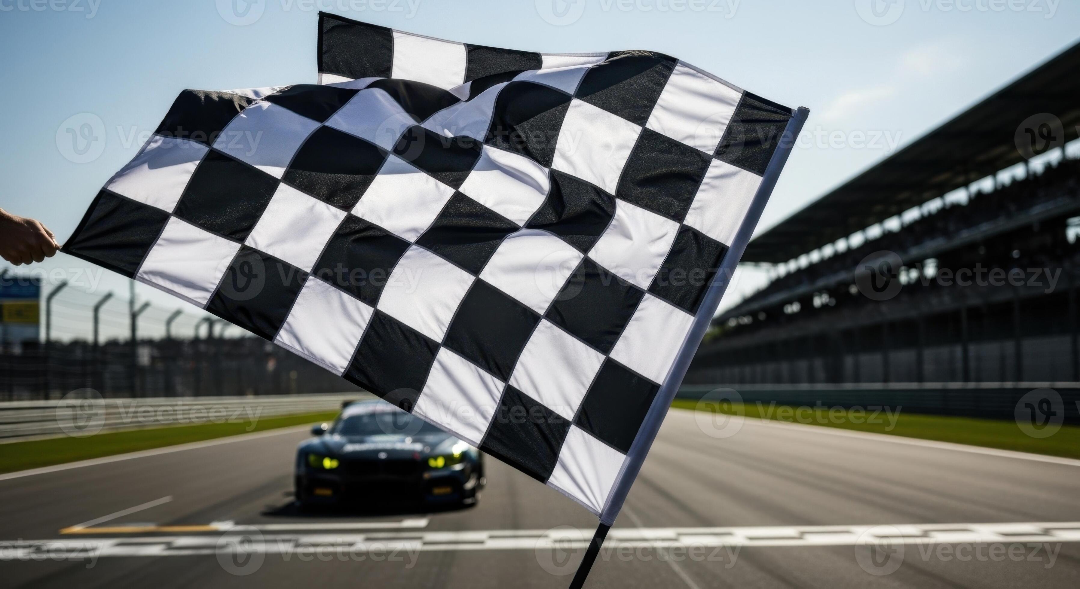 Checkered flag waving at a race track with a car approaching the finish line, symbolizing ...