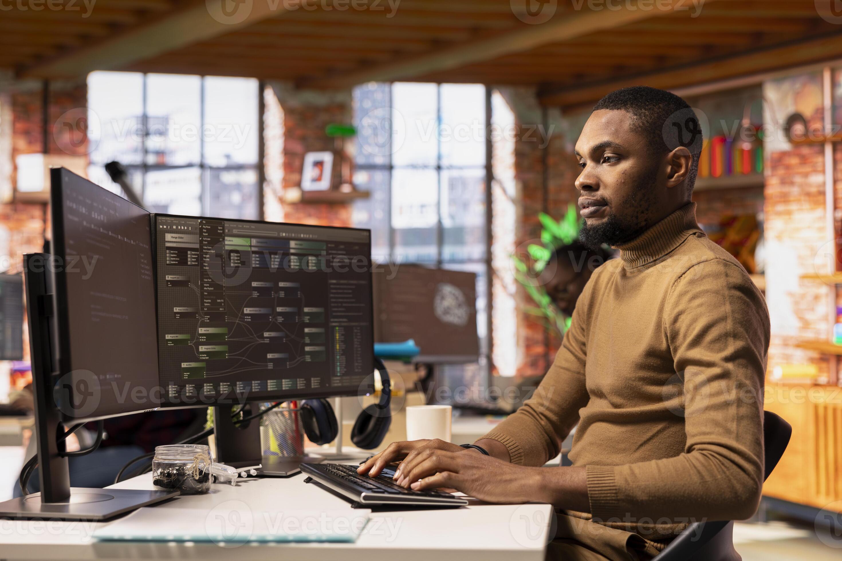 IT engineer using PC in innovative startup office and programming languages to build ...