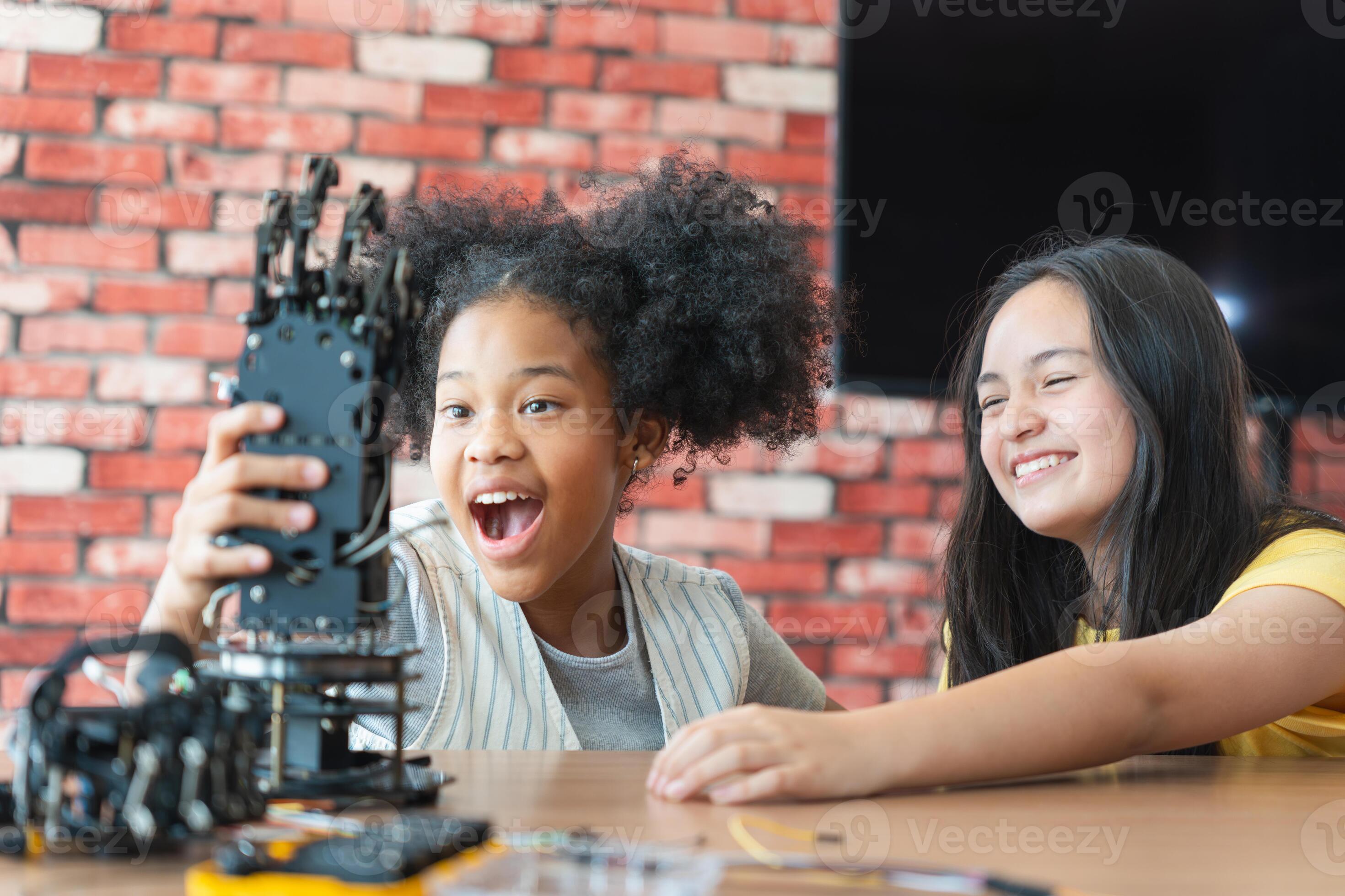 Girls Engaged in Robotics and STEM Learning, Diverse Kids Building a Robot Arm in a Science ...
