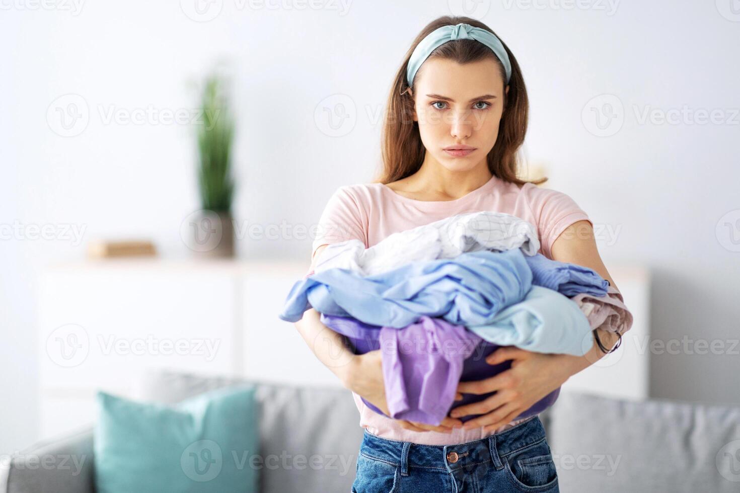 Holding Clothes Stock Photos, Images and Backgrounds for Free Download