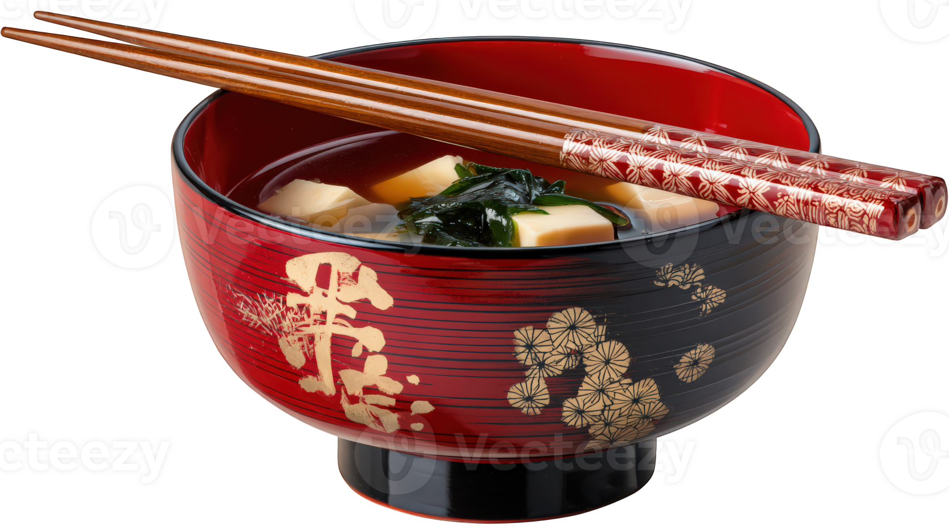 Red lacquer bowl with golden floral pattern filled with miso soup, tofu cubes, seaweed, and ...