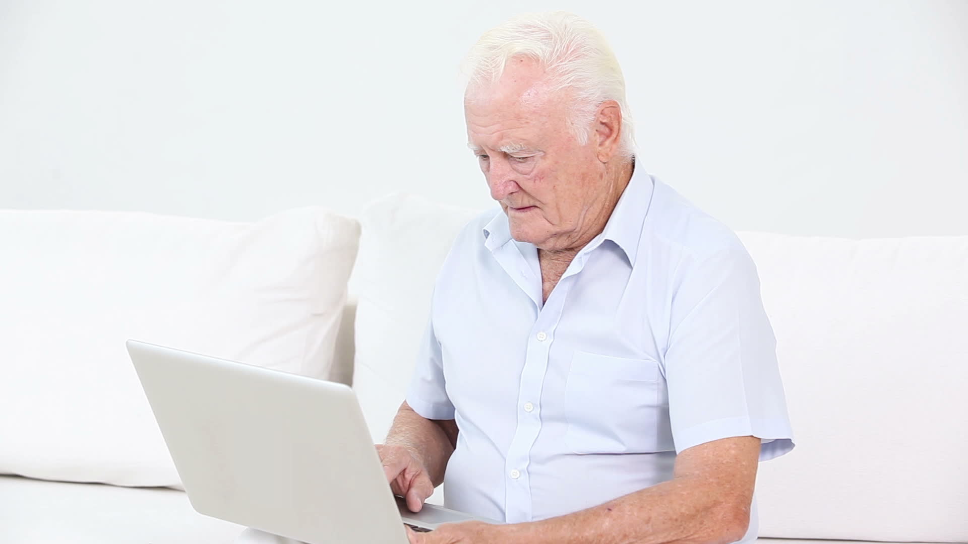 Old man using a laptop 1406690 Stock Video at Vecteezy