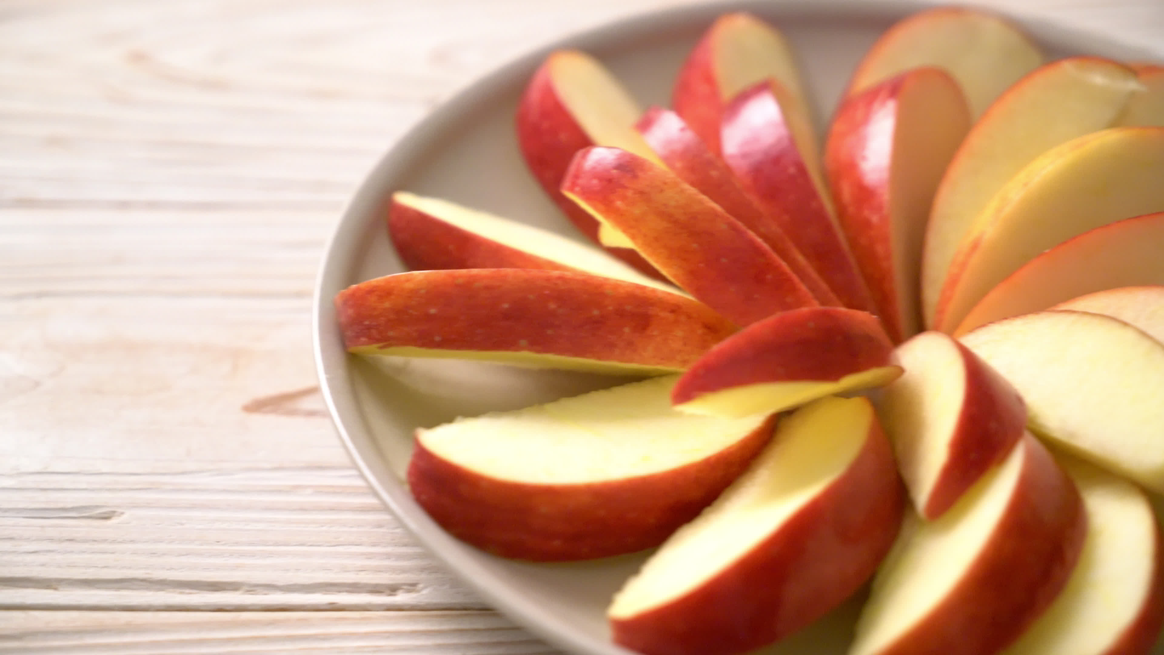 Fresh Red Apple Slices on a Plate 2139717 Stock Video at Vecteezy