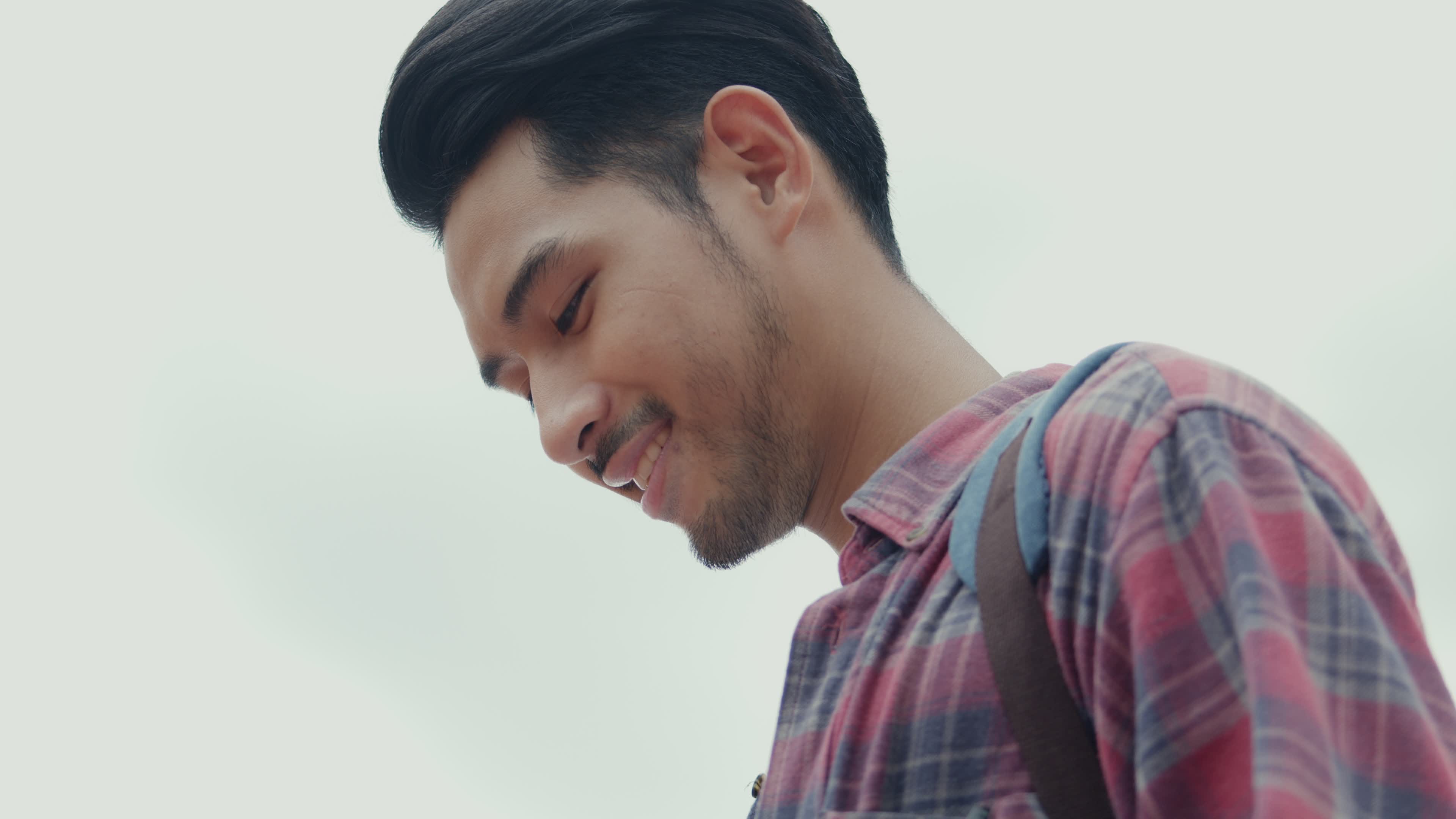 Man Looking Down Smiling