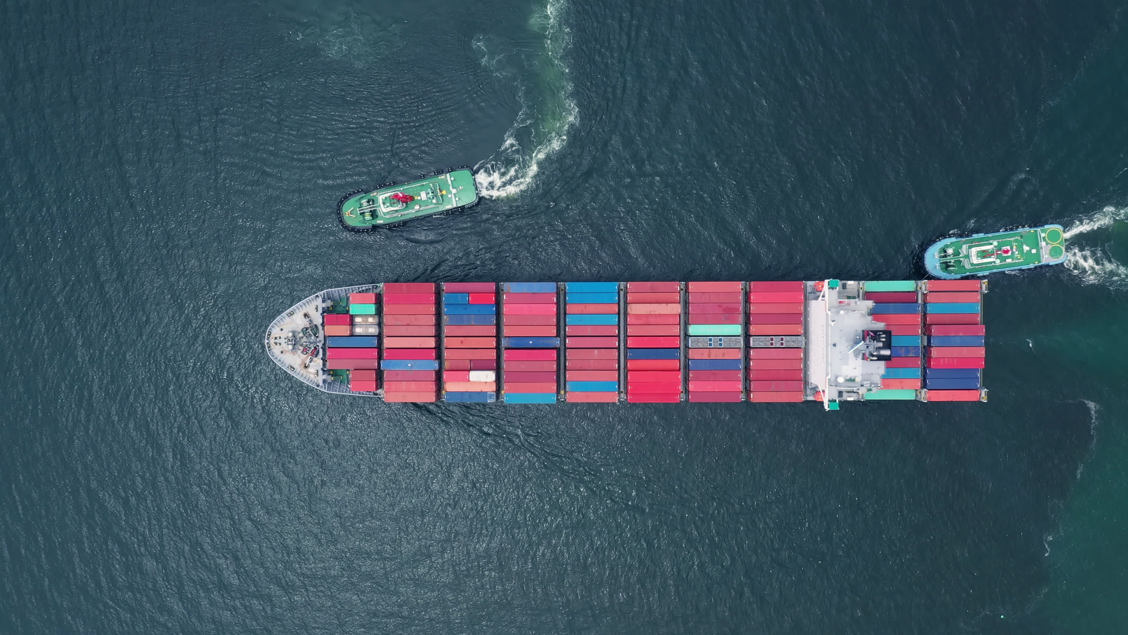 Aerial Of Cargo Ship Carrying Container And Running For Export Goods aerial-of-cargo-ship-carrying-container-and-running-for-export-goods