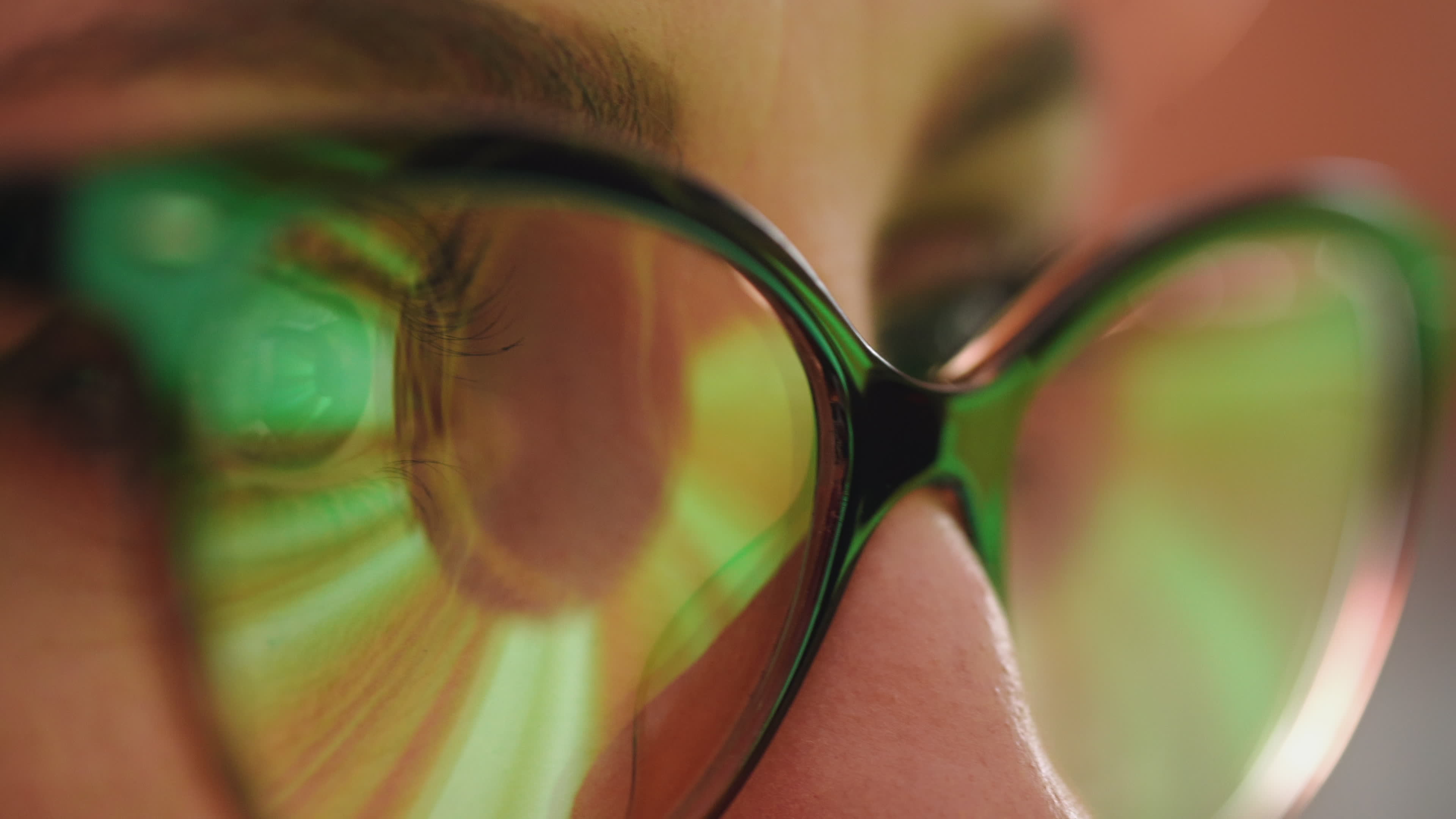 Reflection of screen computer lights on programmer eyeglasses. 5900073 Stock Video at Vecteezy