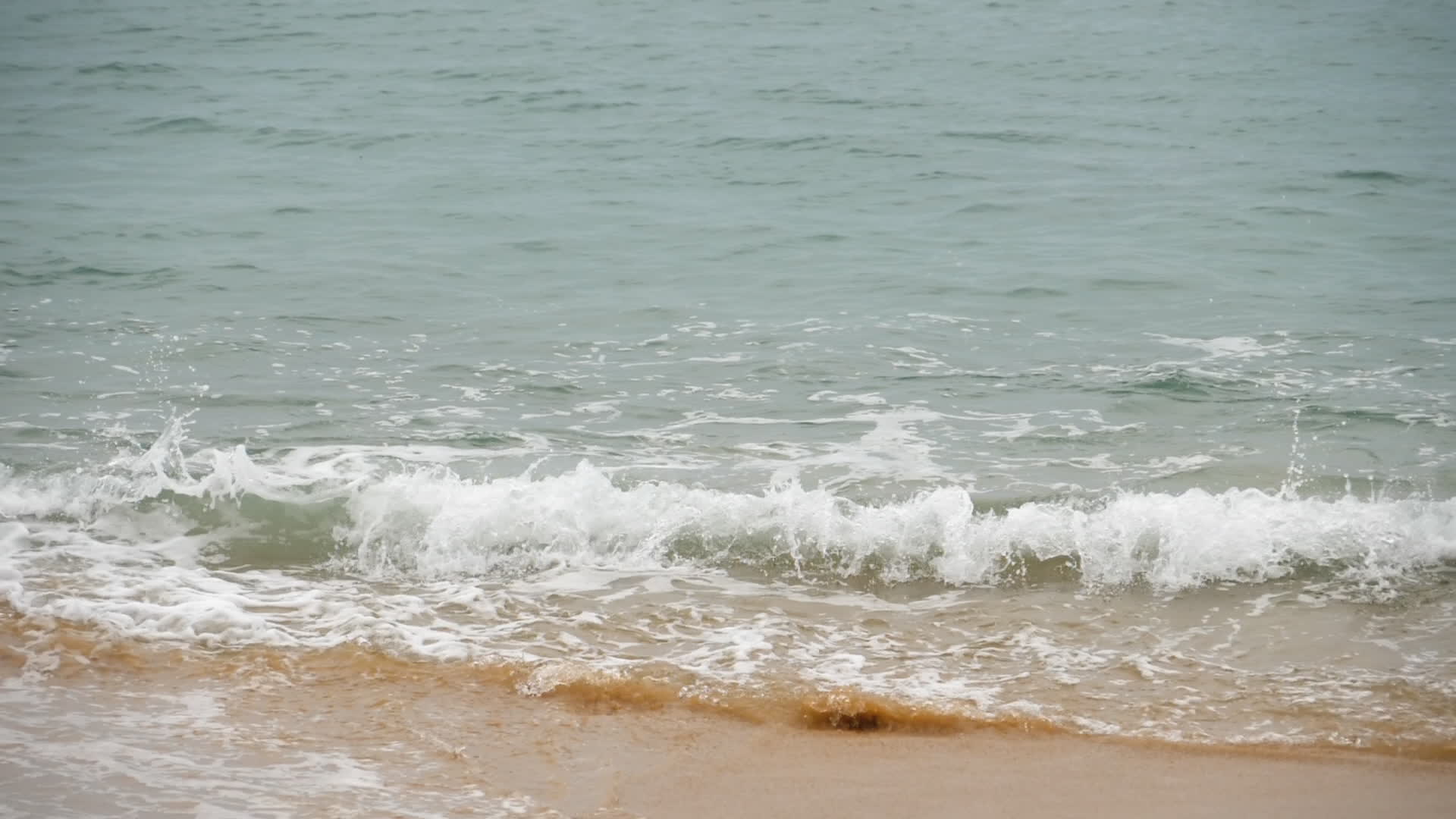 Waves on a sandy beach 7041186 Stock Video at Vecteezy