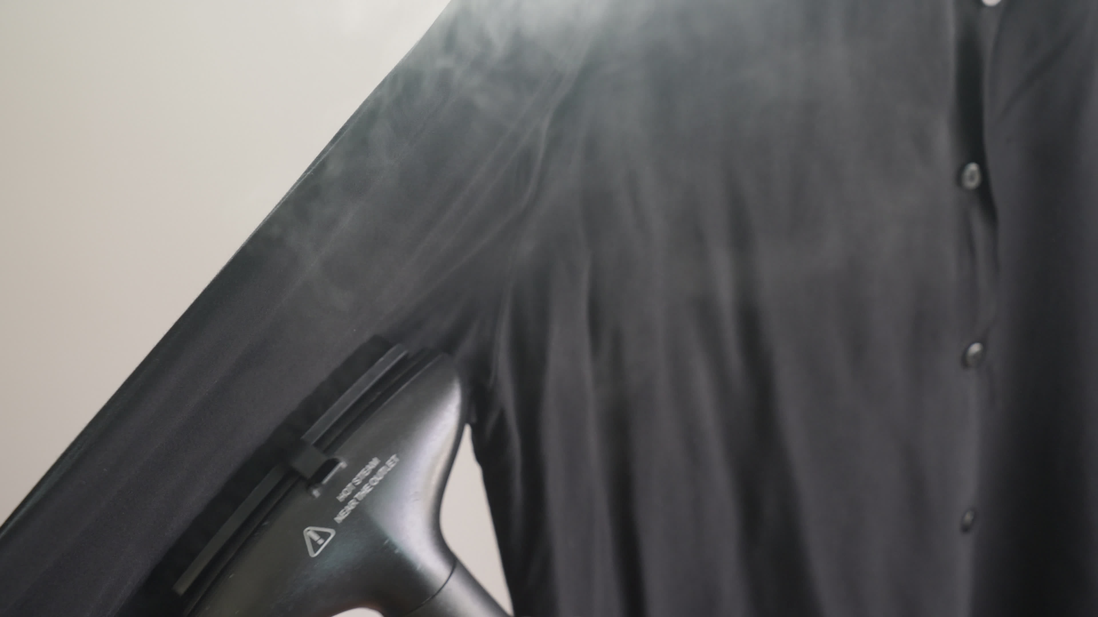 iron clothes with steam iron 7502160 Stock Video at Vecteezy