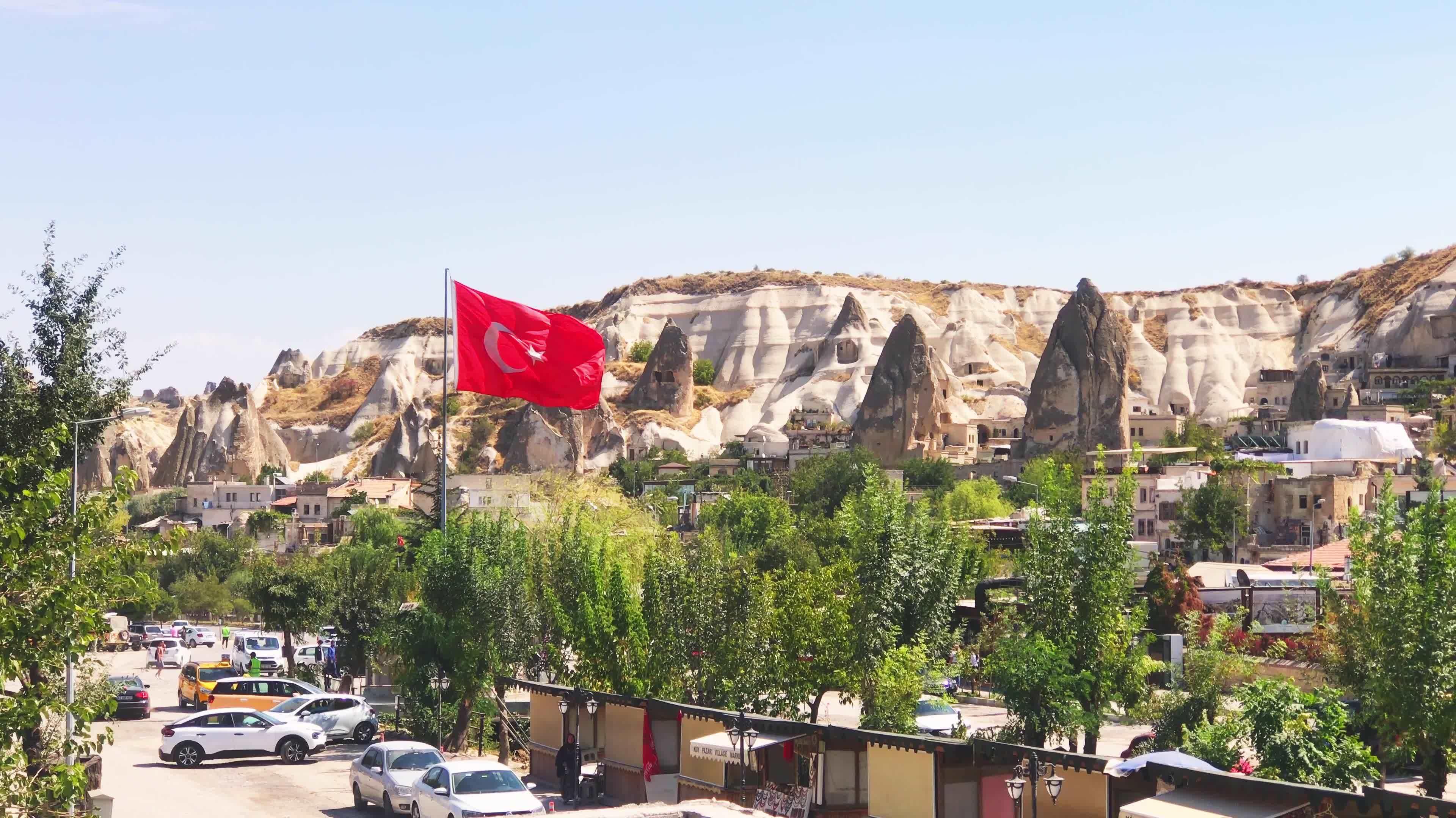 Static view Goreme town panorama with cars and fairy chimneys. Turkey ...