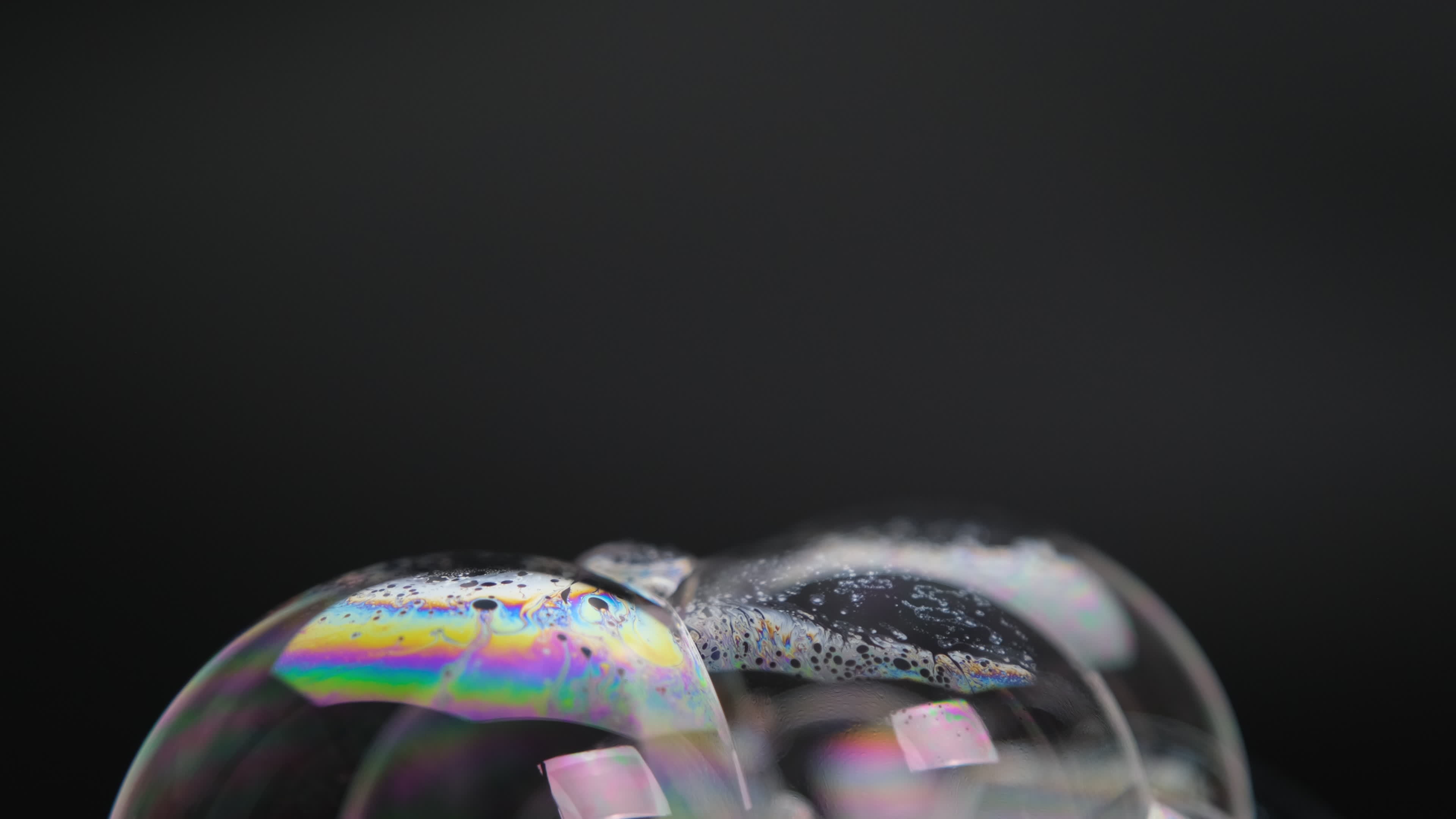 Soap bubbles isolated on black background. Abstract soap bubbles with colorful reflections. Soap ...