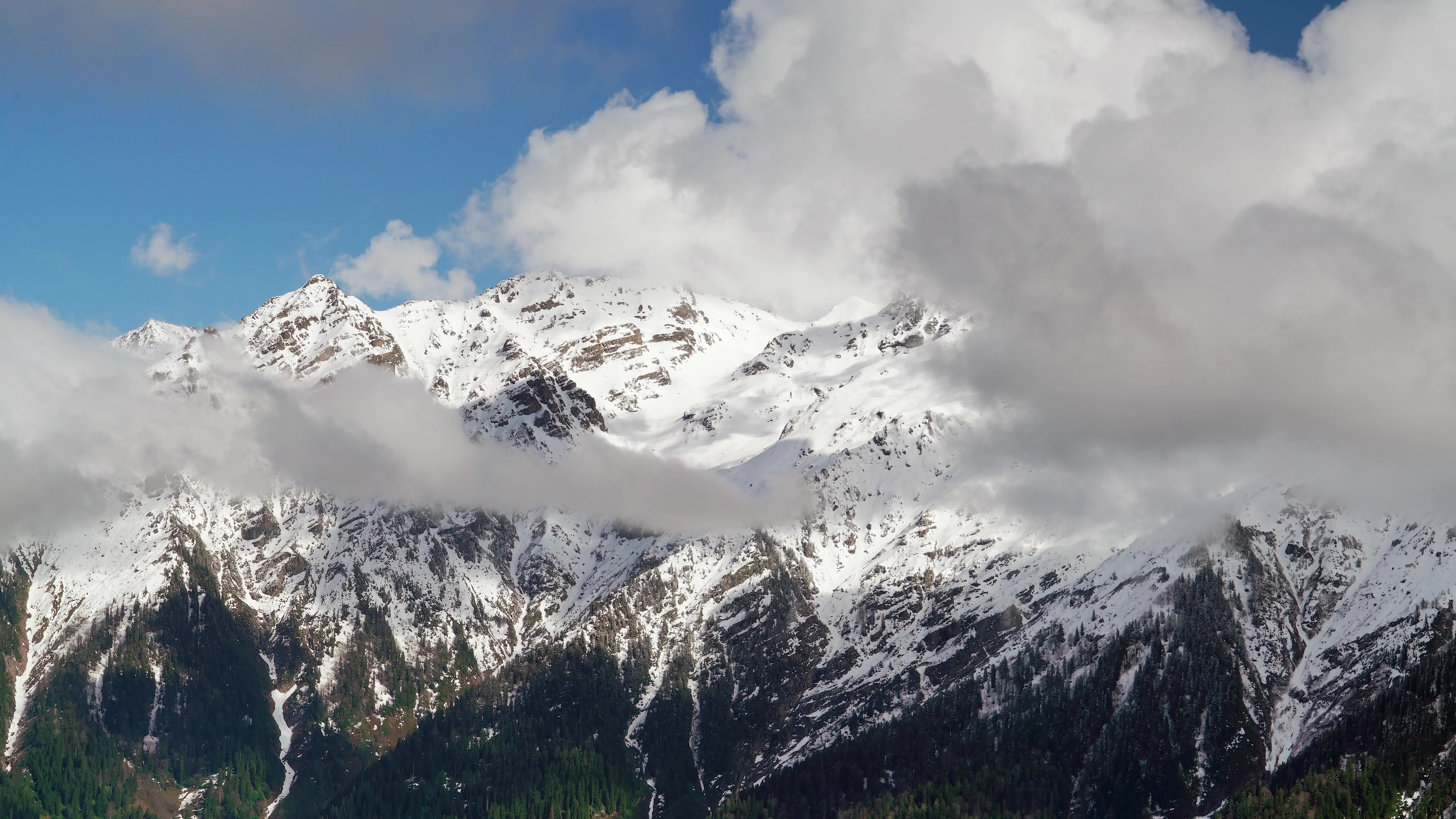 8K Imposing High Snowy Mountain Peaks Behind the Clouds 10449803 Stock ...
