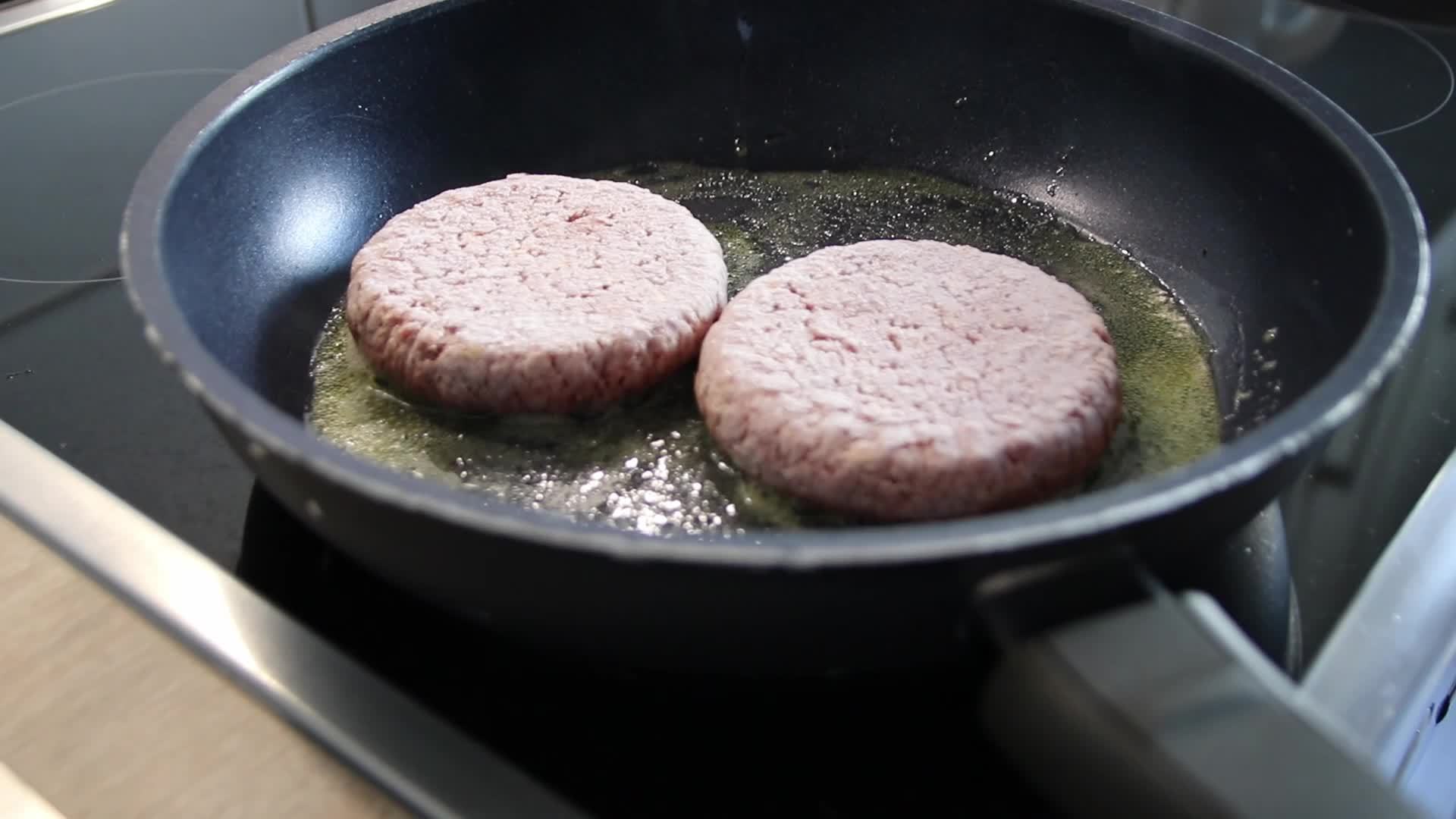 Frozen Burger Patties Burger Meat Sizzling In Hot Pan With Fat And Oil As Delicious Selfmade