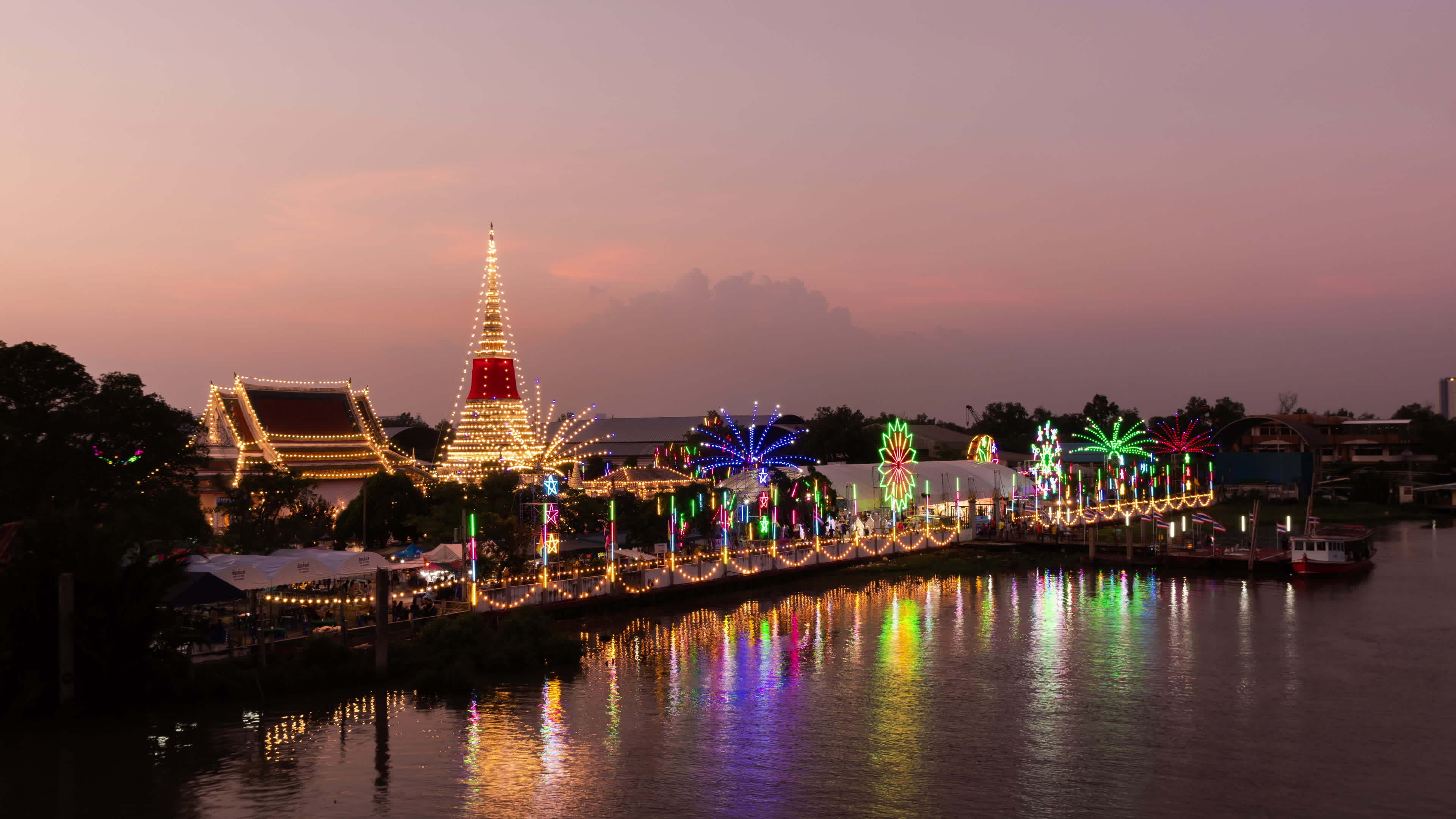 The annual festival of the temple in Samut Prakan province has brightly decorated lights in ...