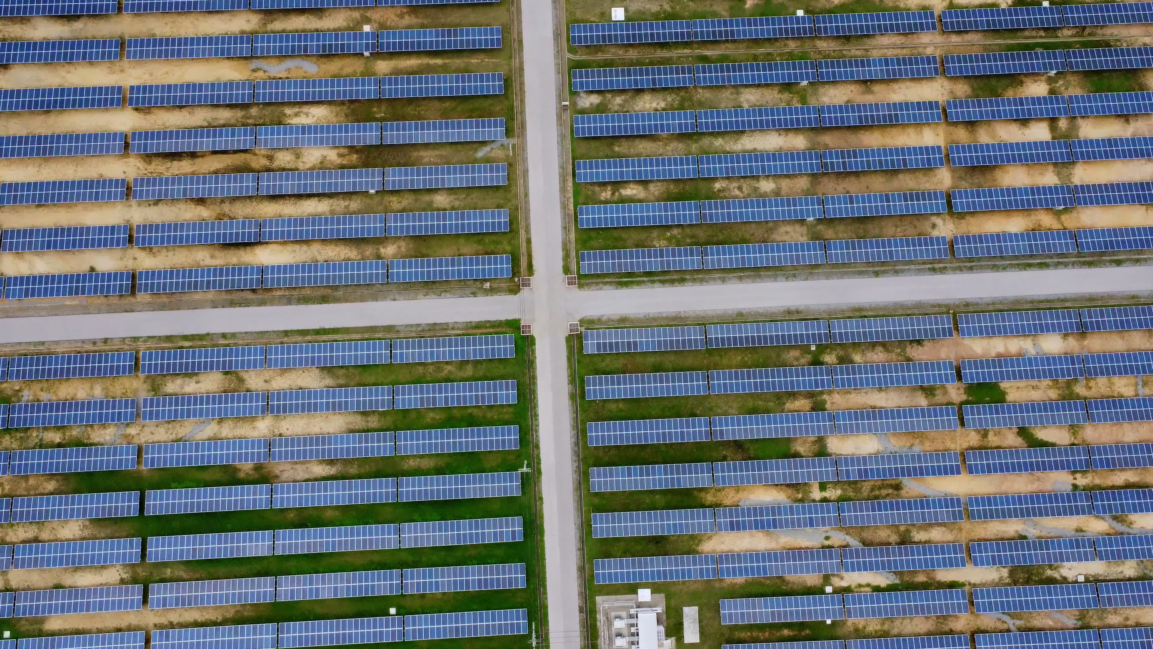 Aerial view of solar power plant on green field. Solar panels system ...