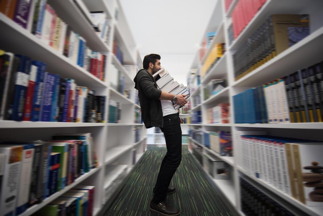 Man In Library Stock Photos, Images and Backgrounds for Free Download