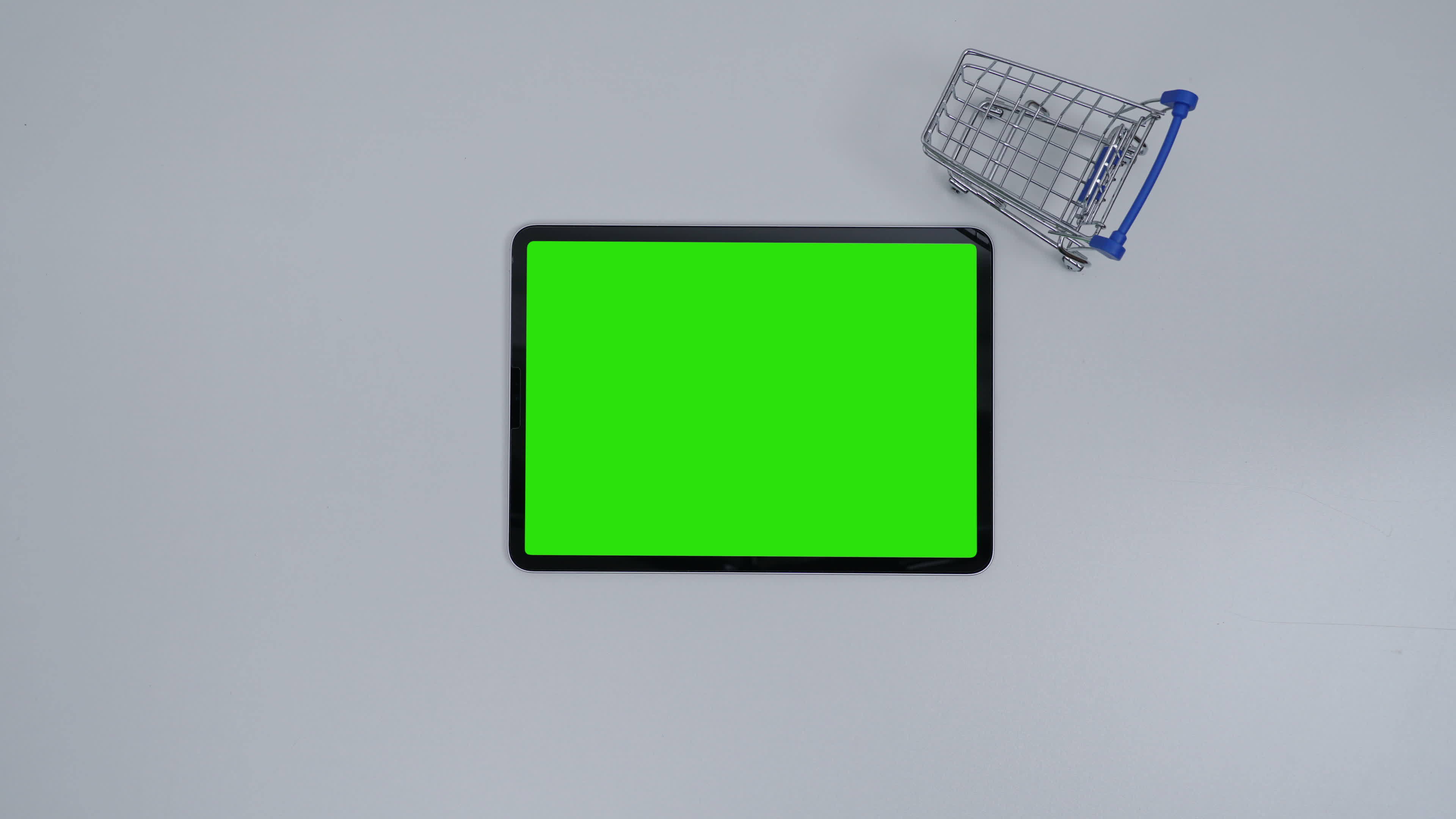 stop motion a cart shopping moving around tablet green screen. 12001380 ...