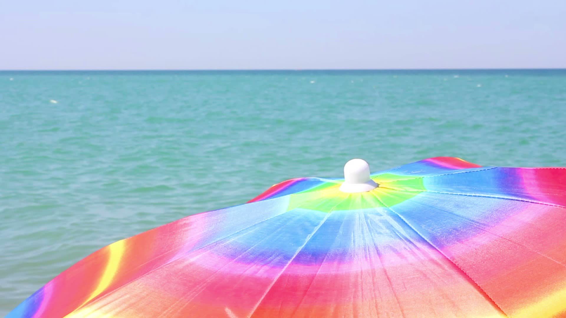A Colorful Beach Umbrella In A Sunny Day 13154232 Stock Video At Vecteezy