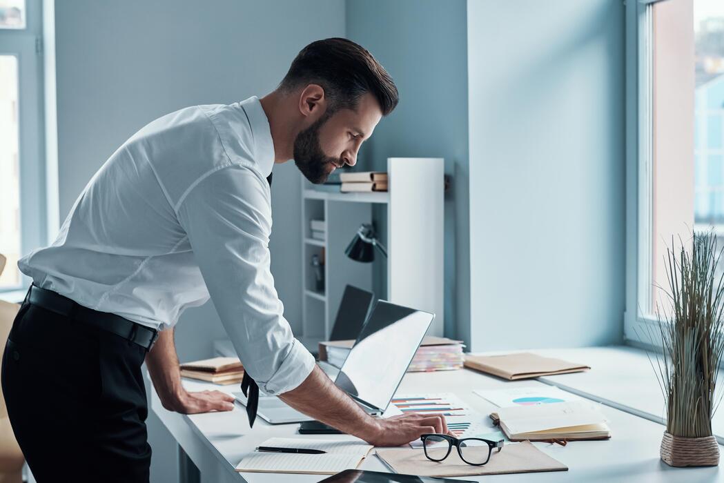 Man Working On Desk Stock Photos, Images and Backgrounds for Free Download