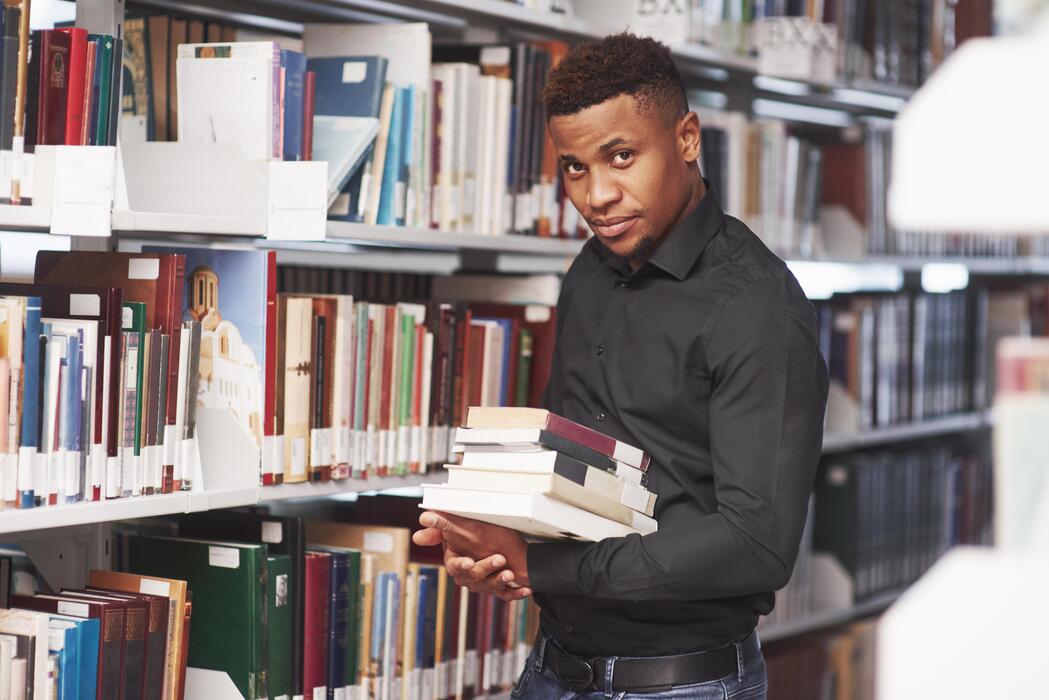 Man In Library Stock Photos, Images and Backgrounds for Free Download
