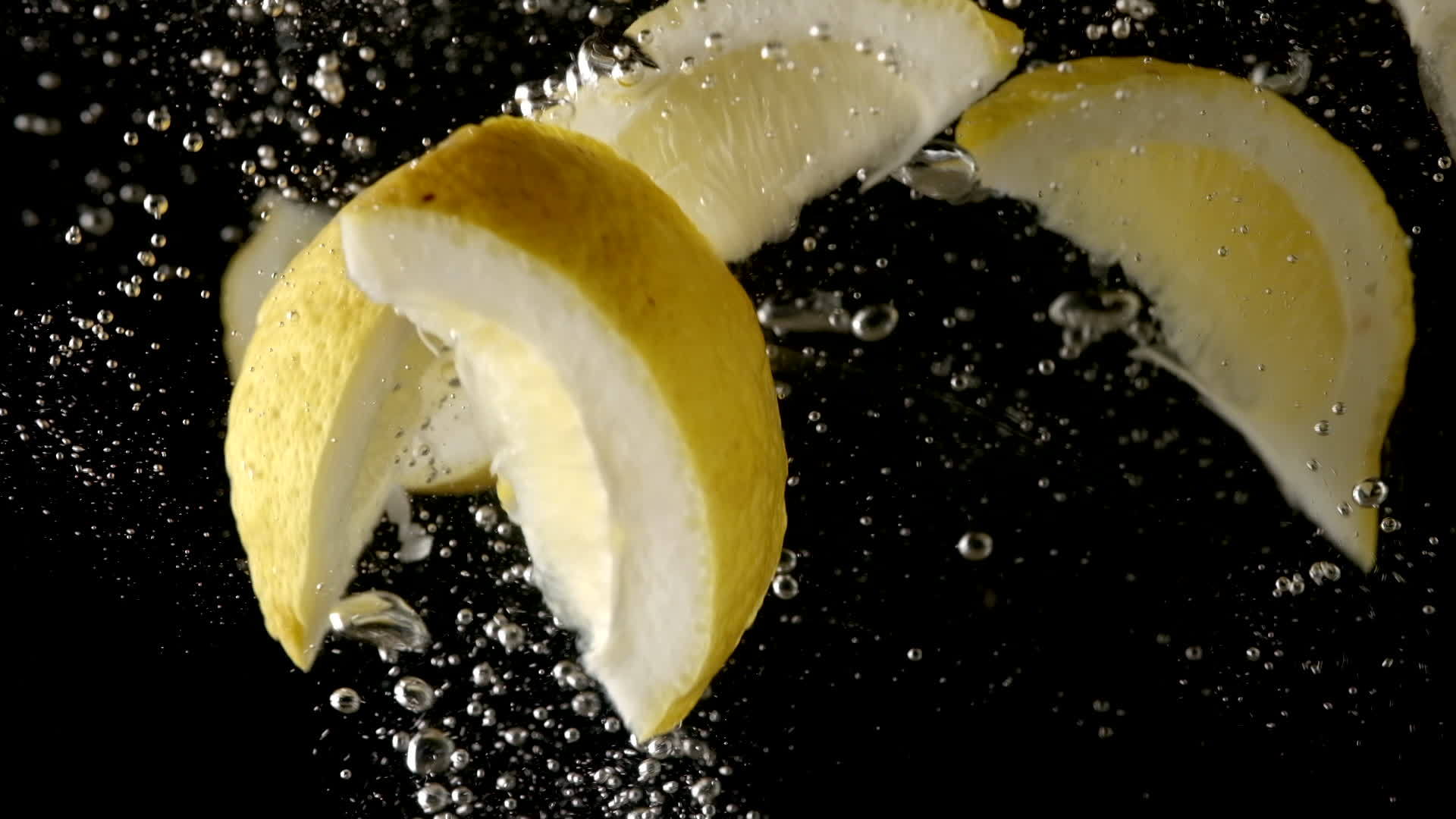 Sliced lemons fruit splashing in water 15692990 Stock Video at Vecteezy