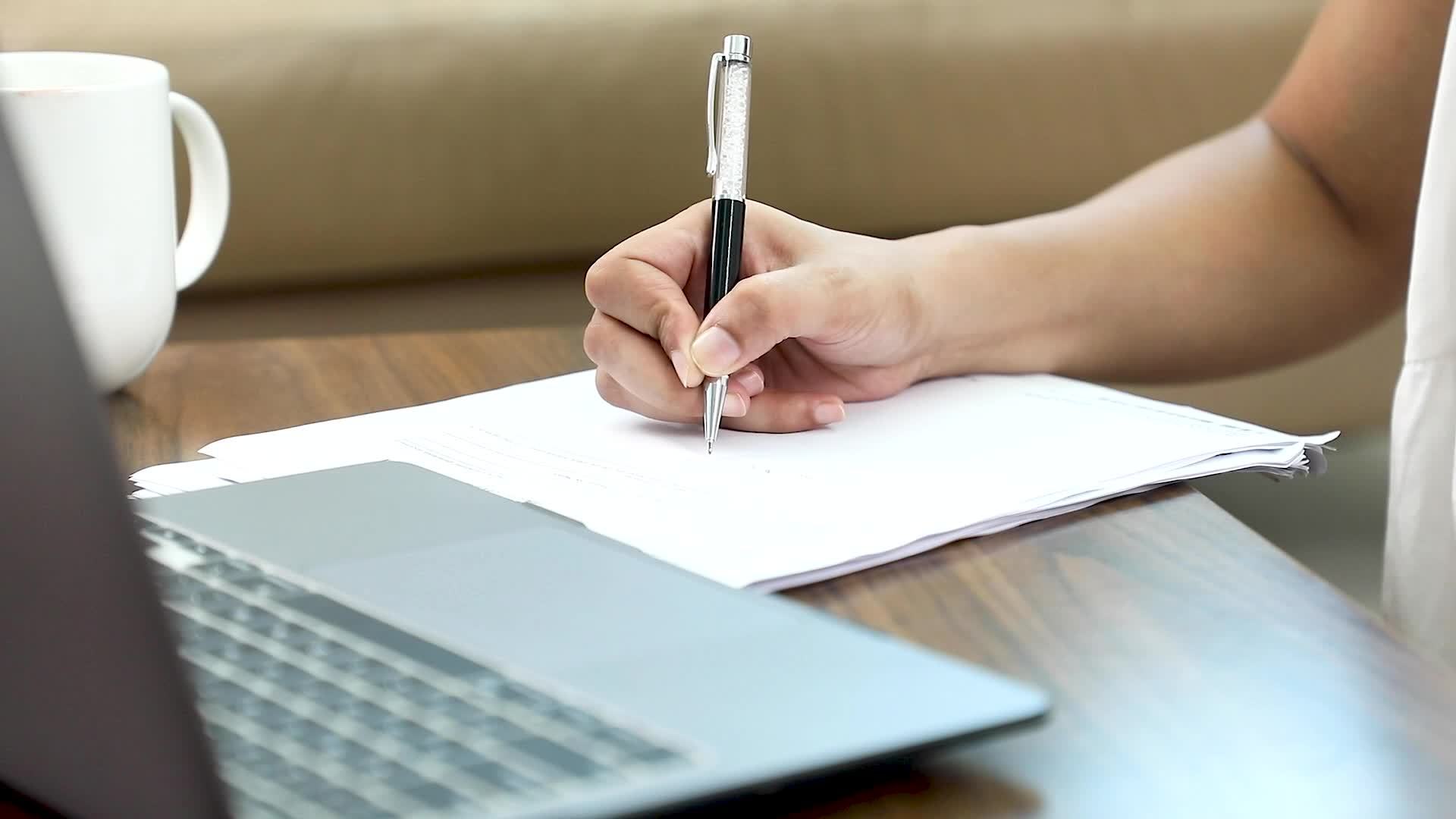 Stock video of woman writing on paper. 15883390 Stock Video at Vecteezy