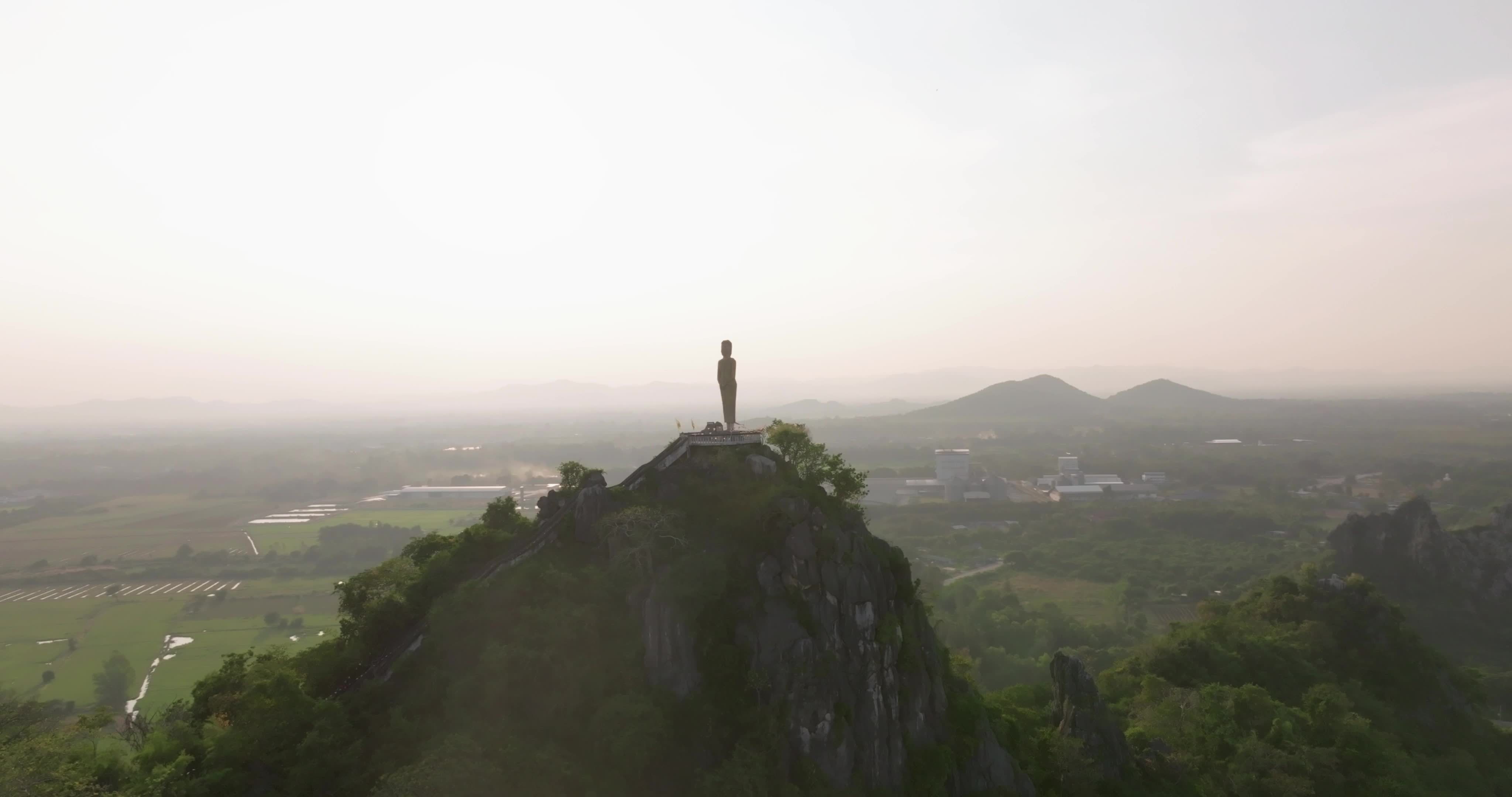 An aerial view of Buddha on the mountain stands prominently at Hup Pha Sawan in Ratchaburi near ...