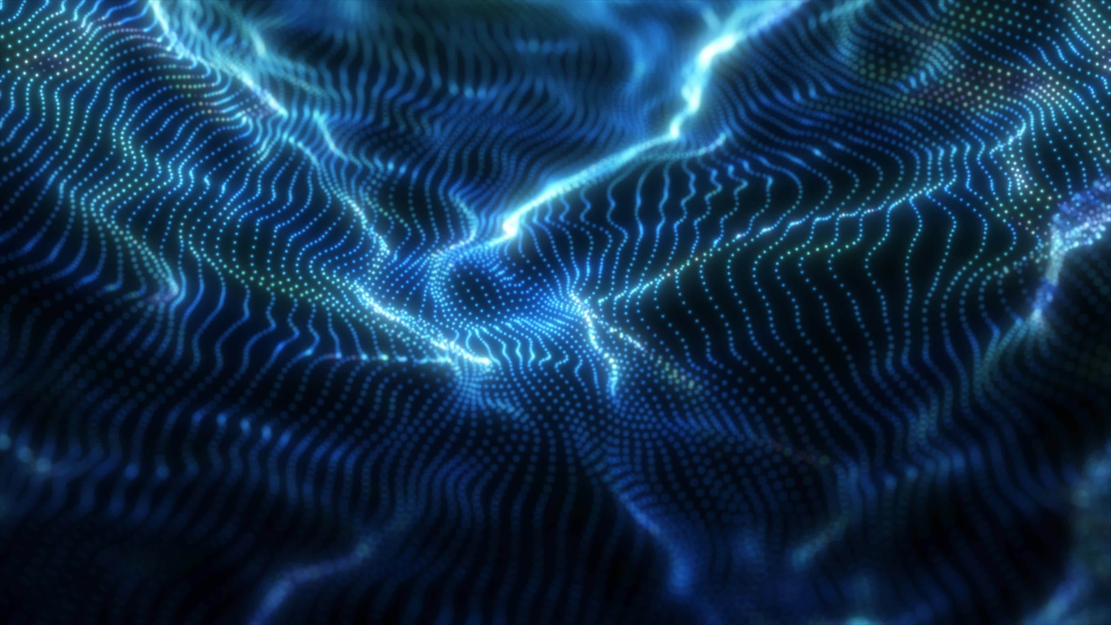 Abstract blue futuristic waves from a grid of particles lines glowing bright shiny neon digital ...