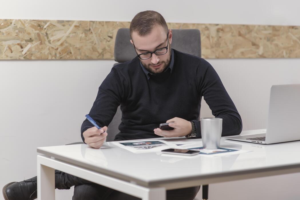Man Working On Desk Stock Photos, Images and Backgrounds for Free Download
