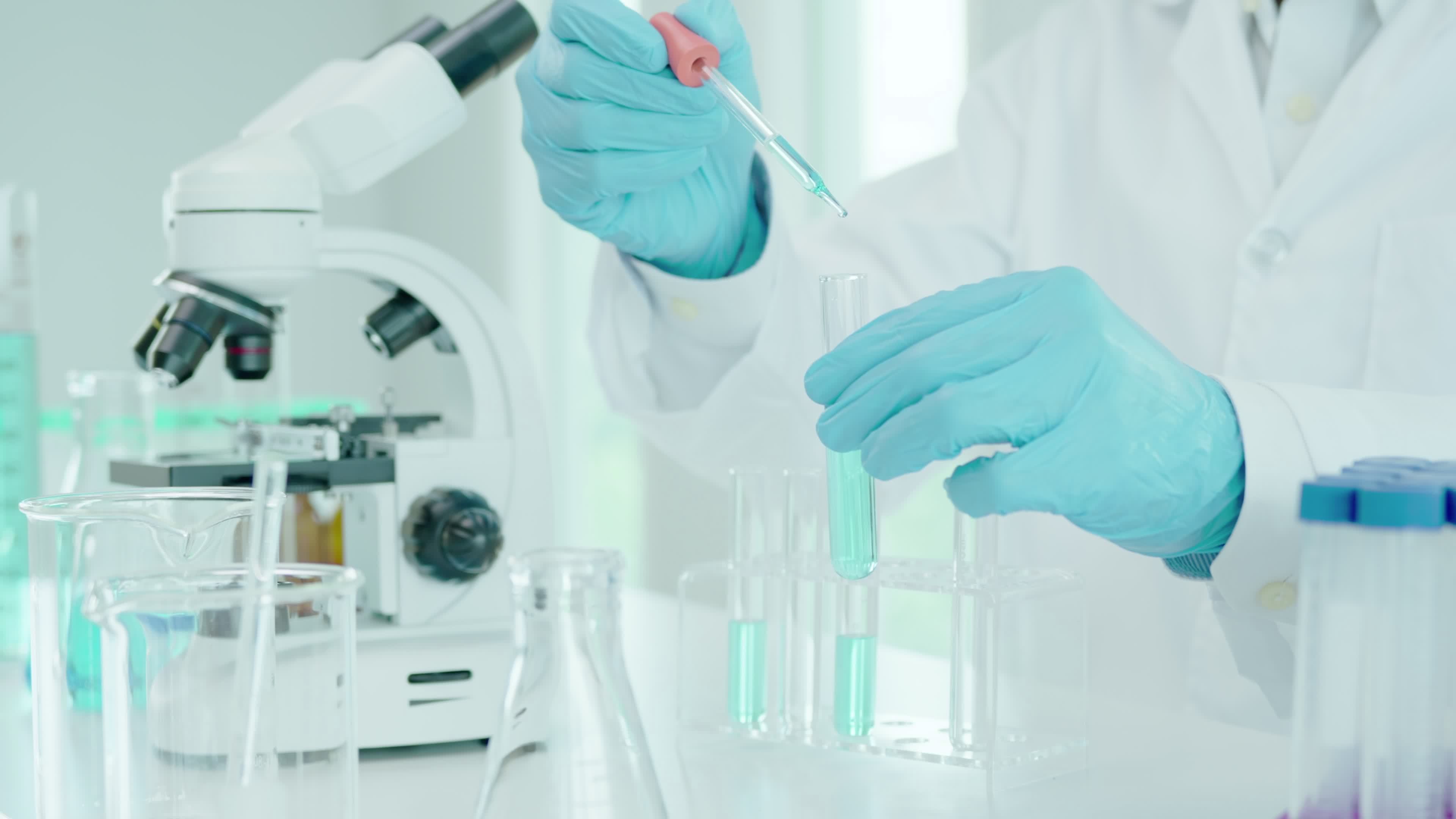 Scientist analyze biochemical samples in advanced scientific laboratory ...