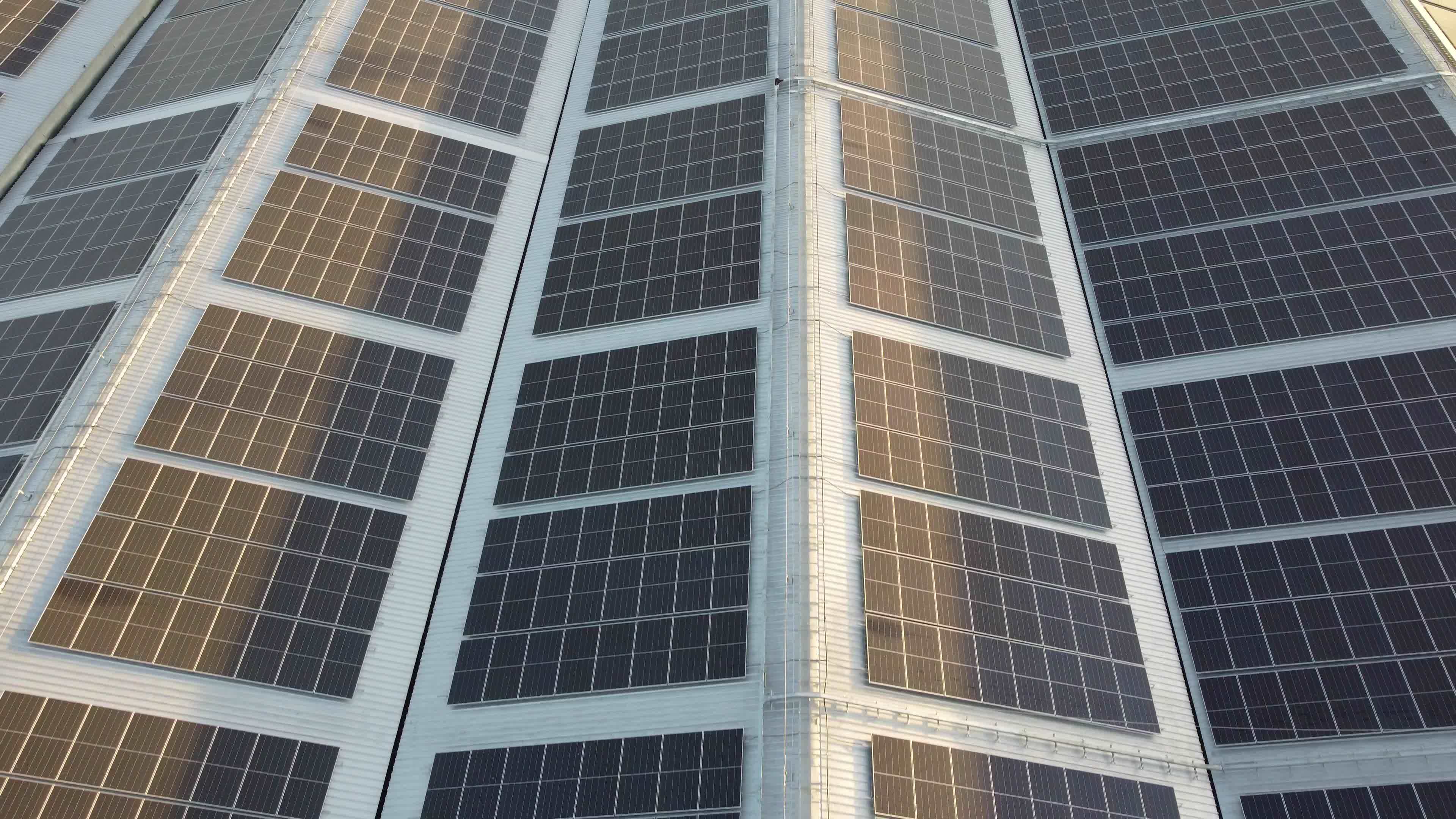 Fly over Solar cells farm beside nature green farm around large ...