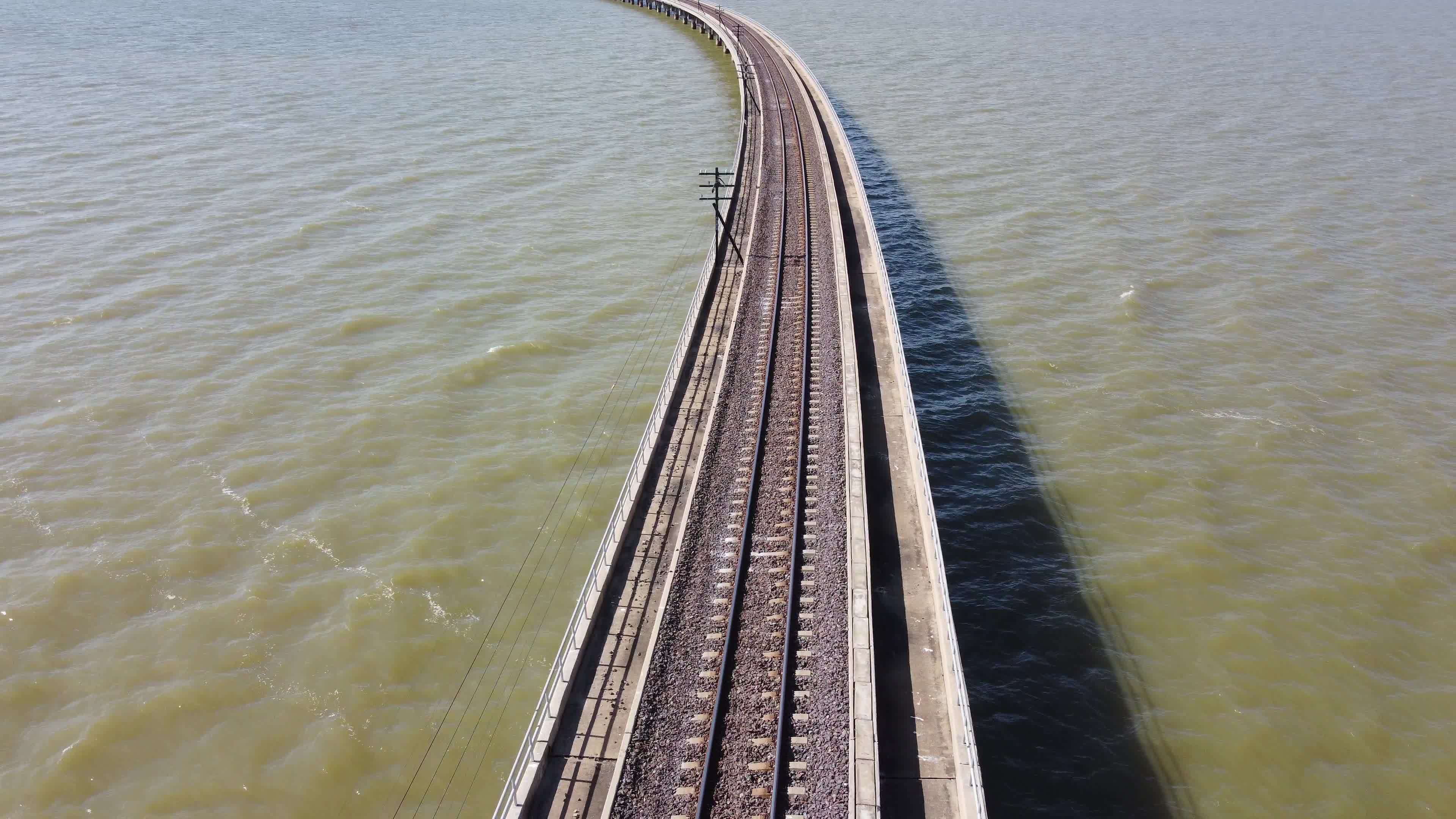 Aerial view of an amazing travel train parked on a floating railway ... Aerial view of an amazing travel train parked on a floating railway ...