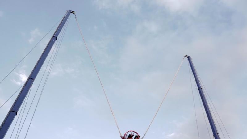 Extreme flying dangerous attraction. Jumping on rubber ropes. Extreme ...