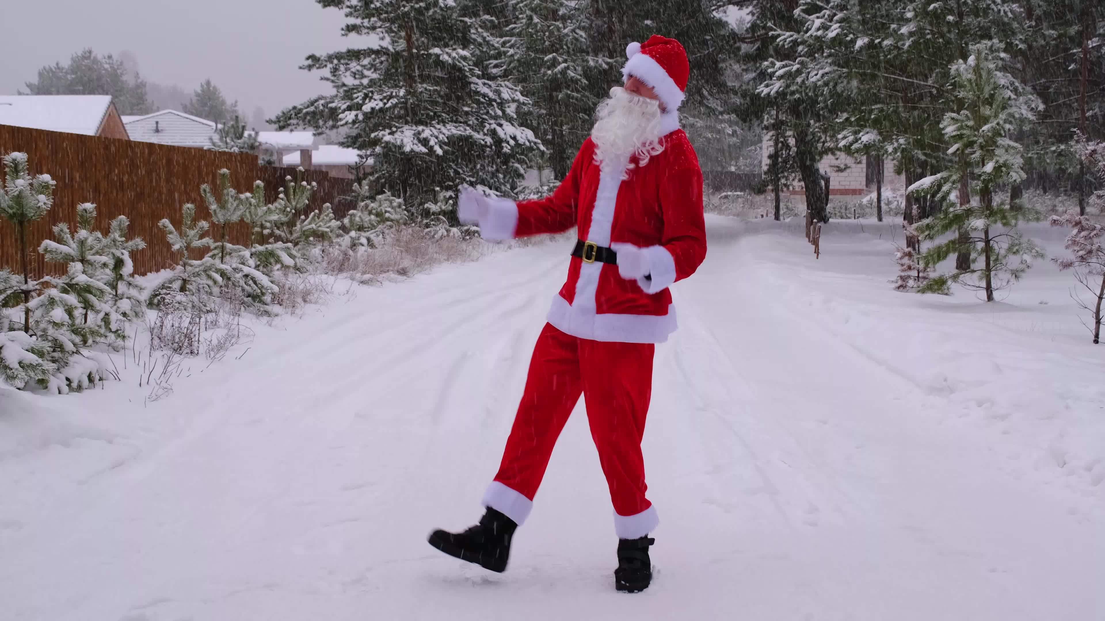 Santa Claus Is Having Fun And Funny Dancing Shows Acrobatic Tricks Elements Of Fighting And