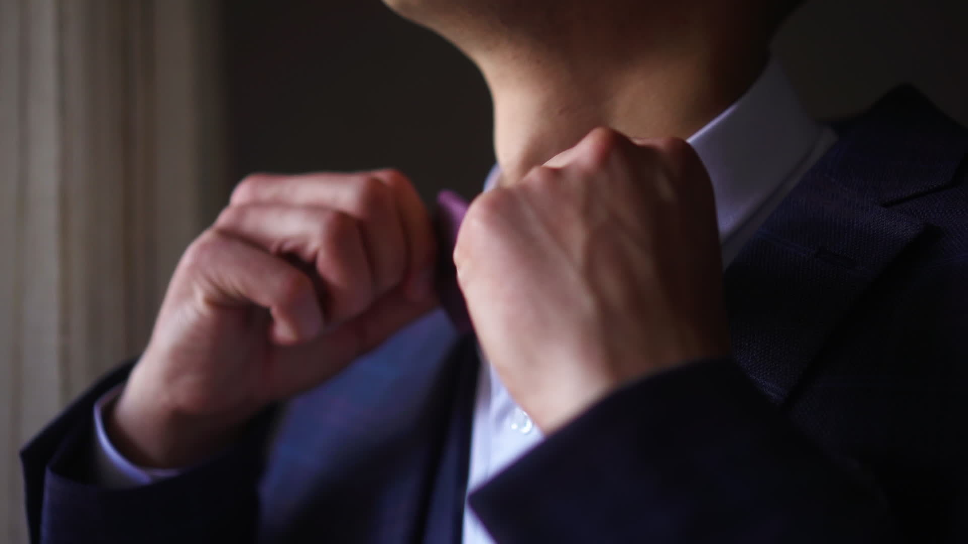 A man puts on his beautiful bow tie. 18885830 Stock Video at Vecteezy