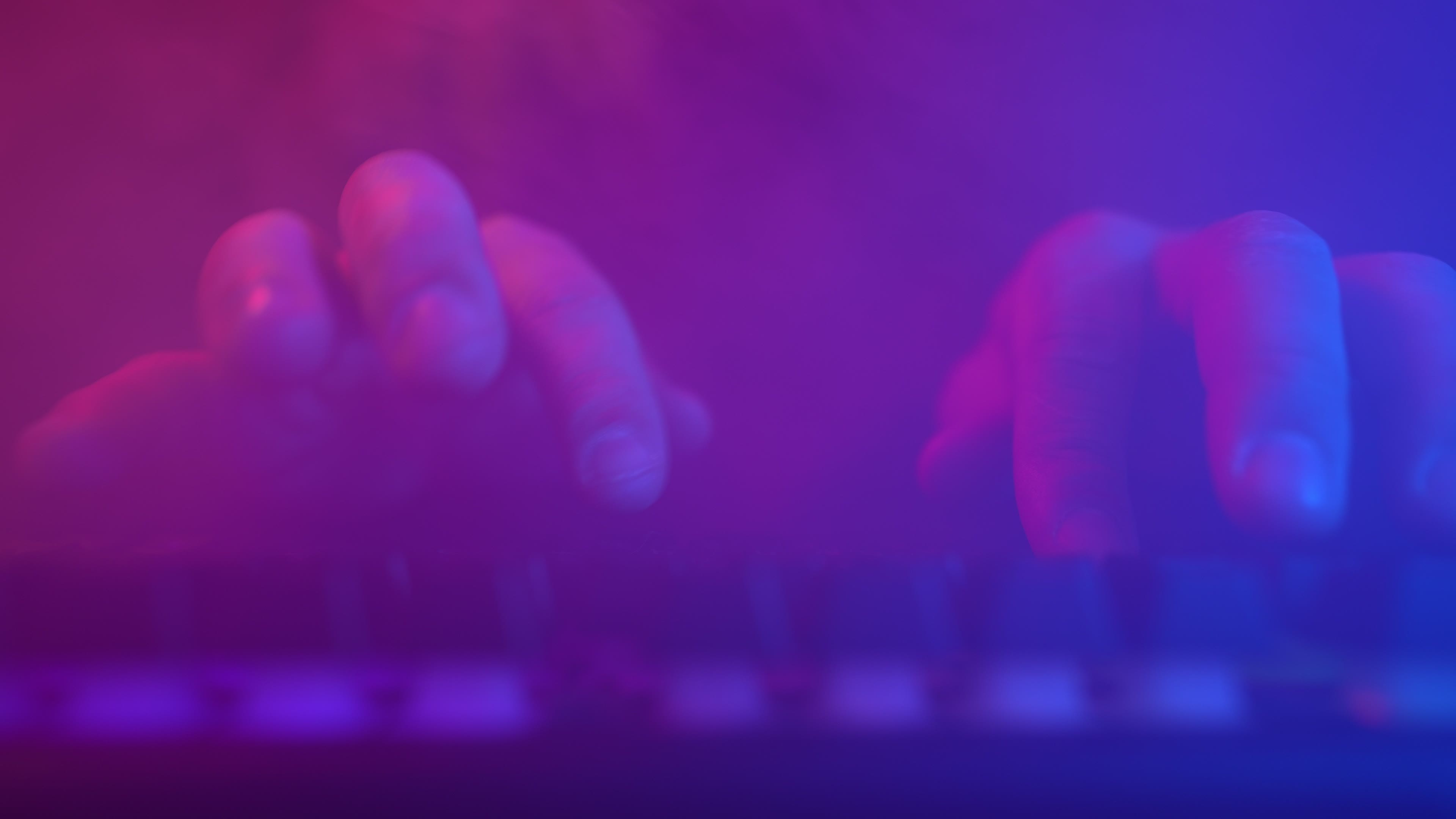 Male Hands Typing on a Computer Keyboard in Neon Lighting. Unrecognizable Guy Working on a ...