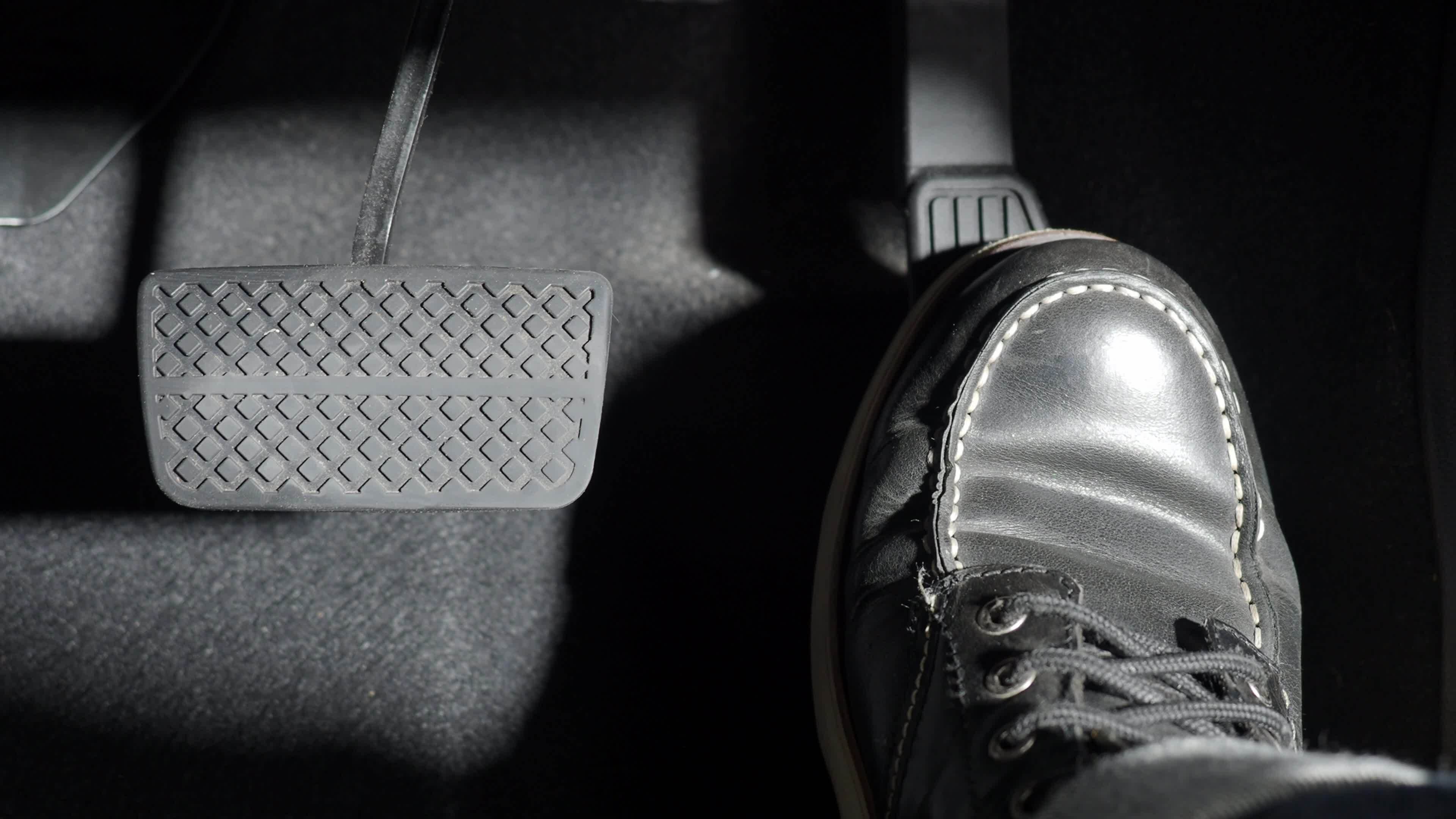 Accelerate and Brake. Foot pressing foot pedal of a car to drive ahead ... Accelerate and Brake. Foot pressing foot pedal of a car to drive ahead ...