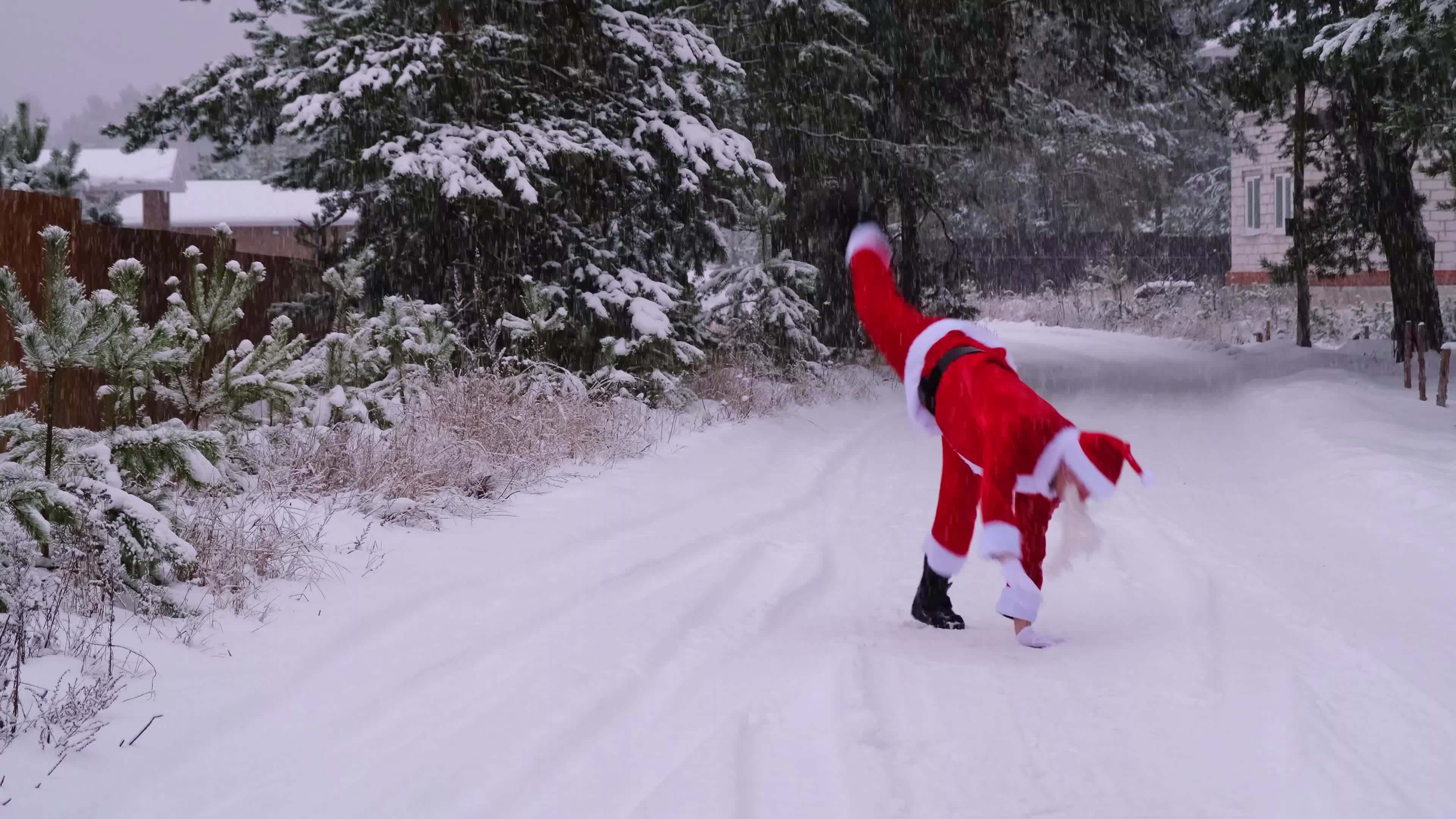 Santa Claus Is Having Fun And Funny Dancing Shows Acrobatic Tricks Elements Of Fighting And